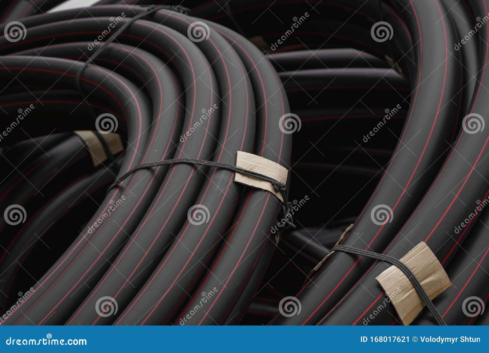 Black Rubber or Plastic Pipes with a Red Lines As a Construction ...