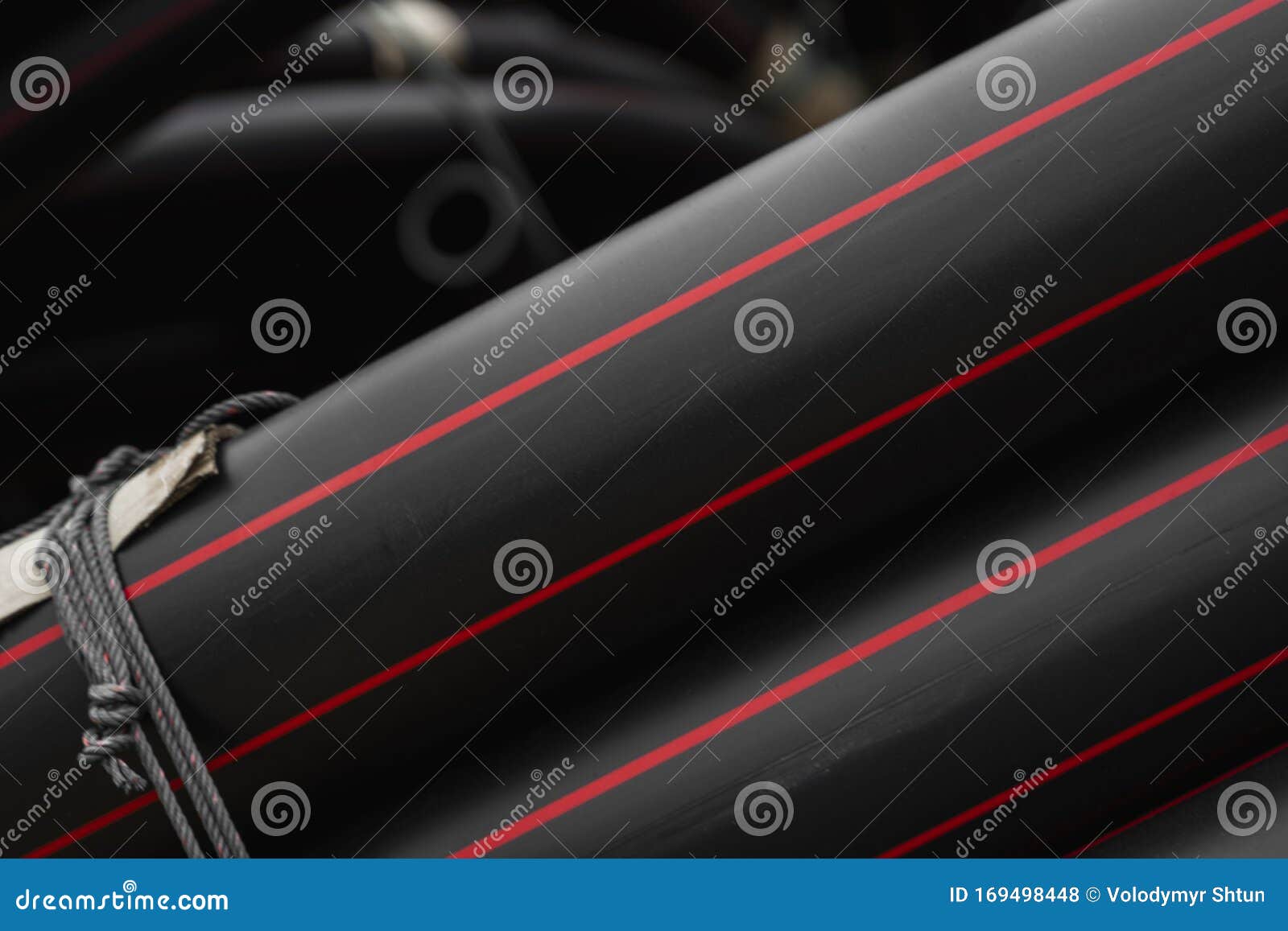 Black Rubber or Plastic Pipes with a Red Lines As a Construction ...