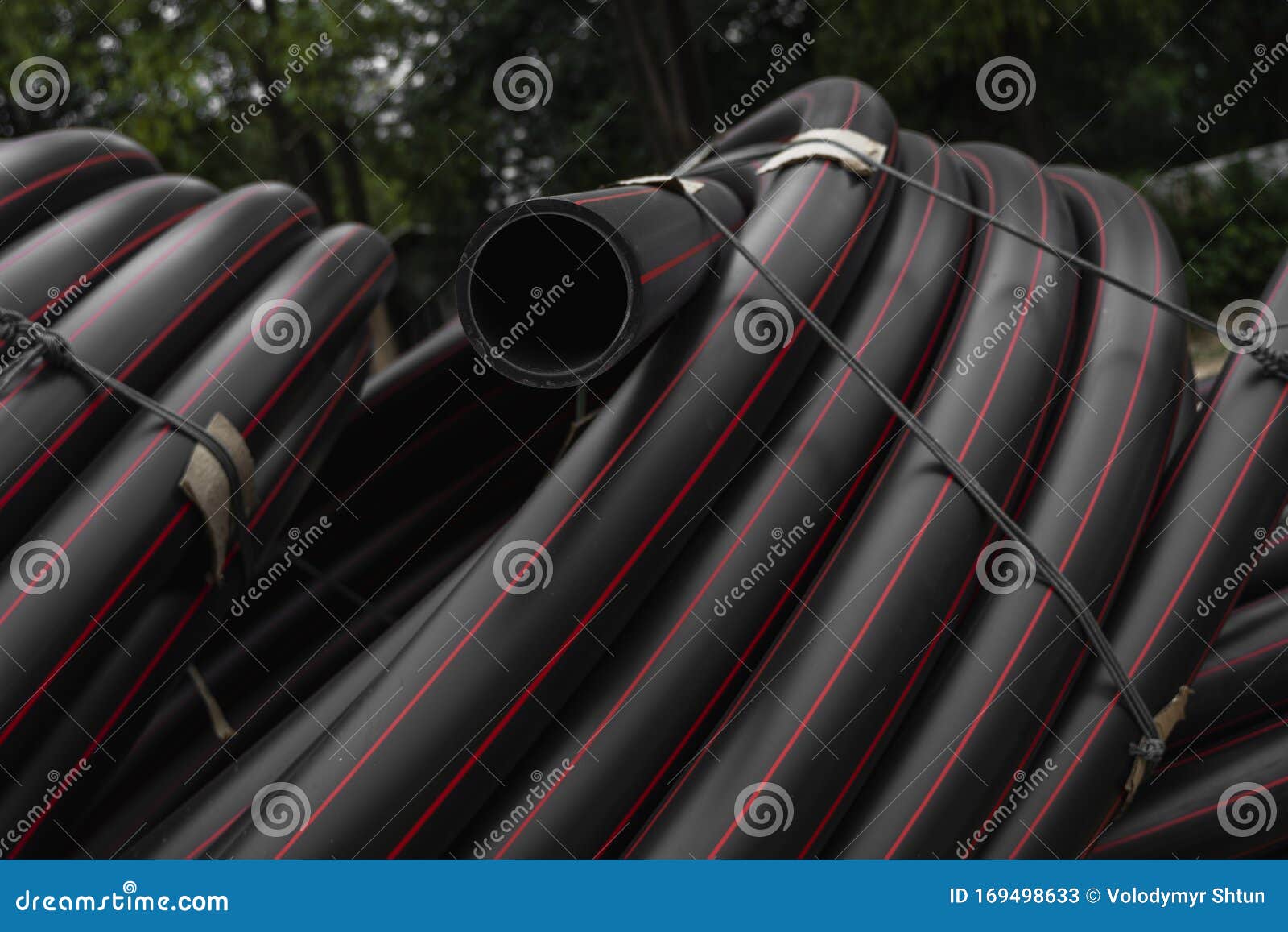 Black Rubber or Plastic Pipes with a Red Lines As a Construction ...