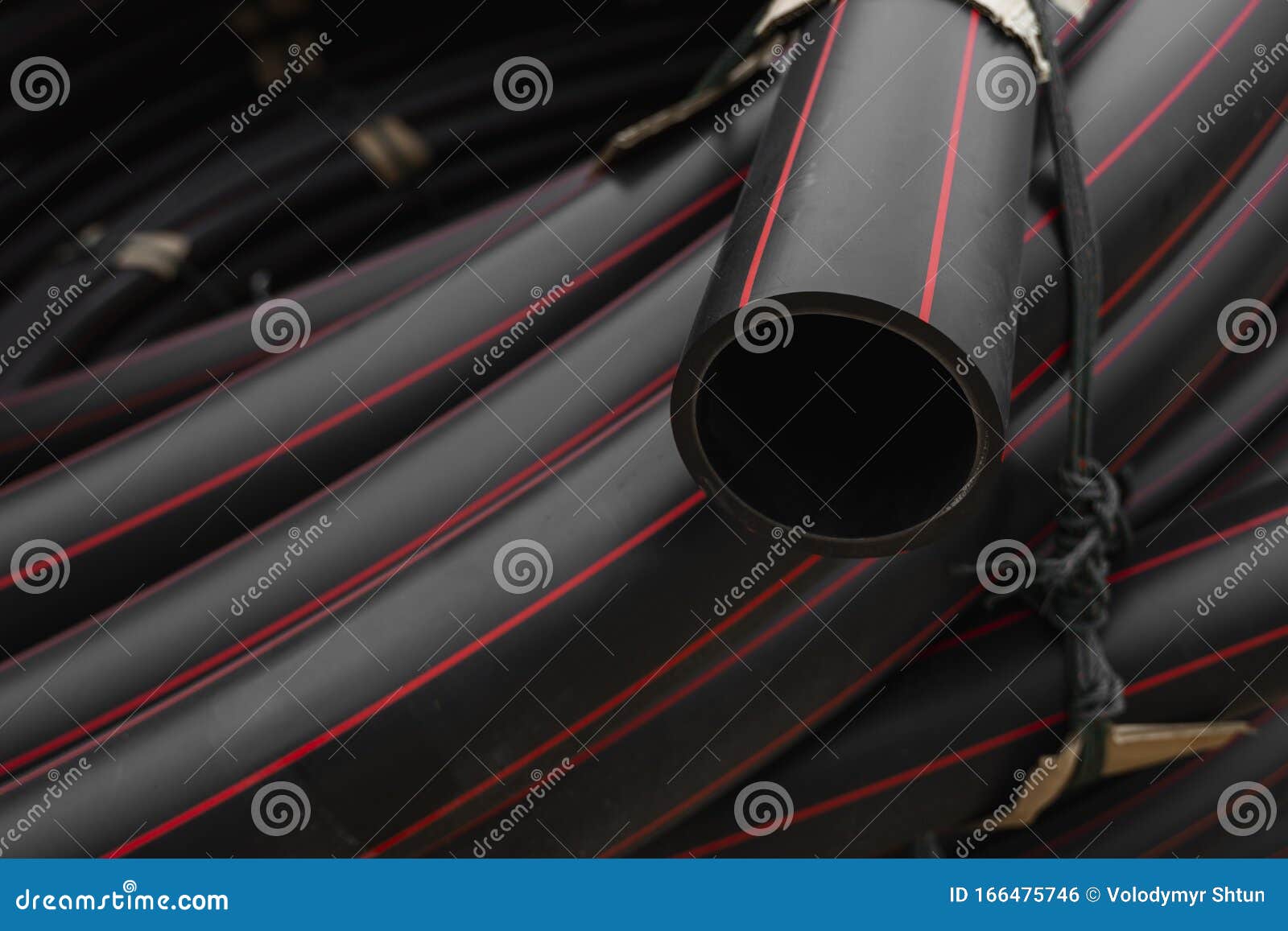 Black Rubber or Plastic Pipes with a Red Lines As a Construction ...