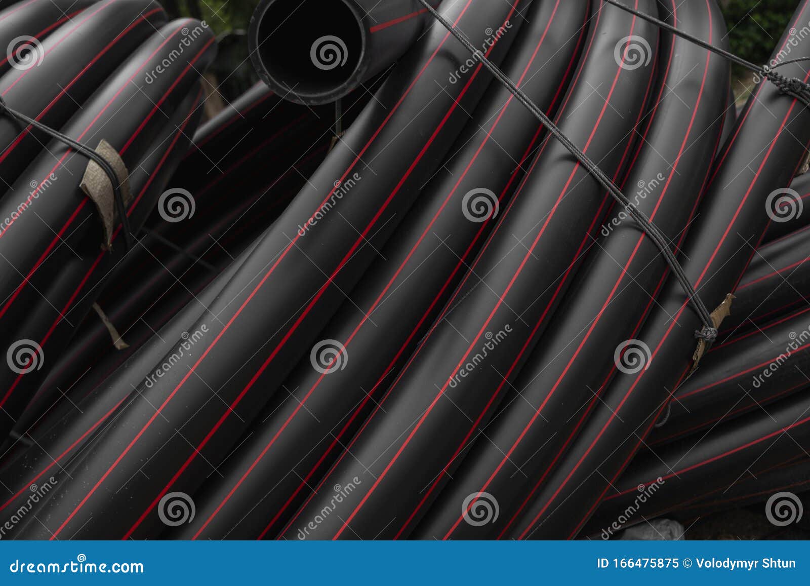 Black Rubber or Plastic Pipes with a Red Lines As a Construction ...
