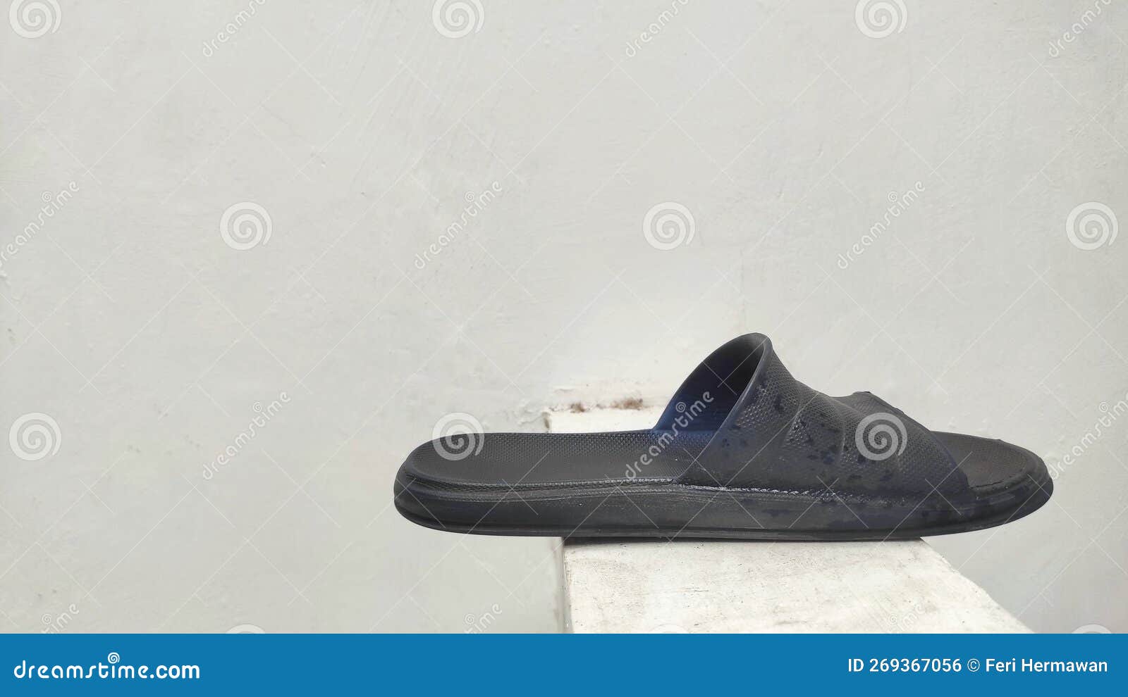 Black Sandals Stained with Dust on a White Background Stock Photo ...