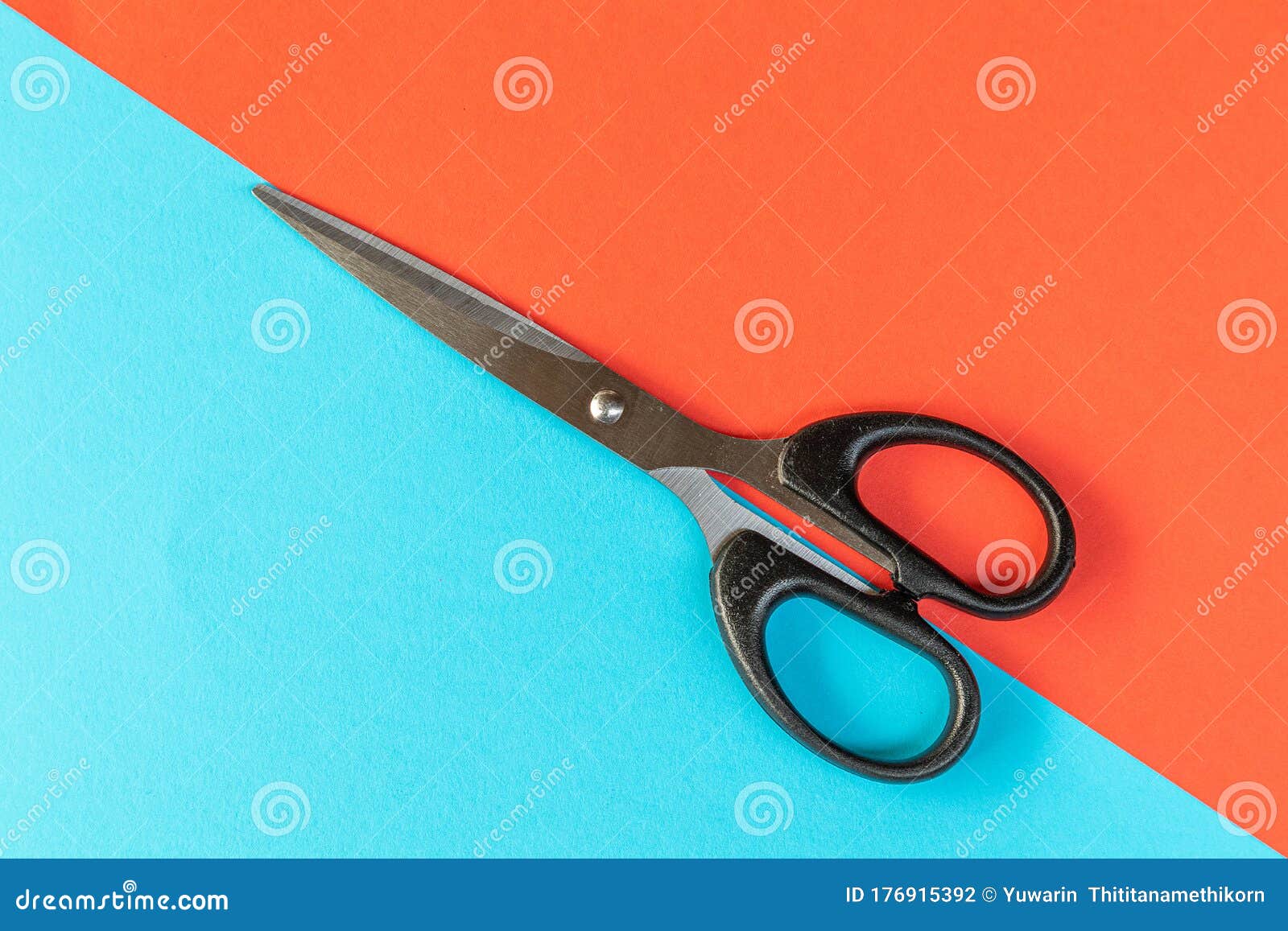 Black Scissors on Blue and Red Color Paper Texture Background. Stock ...