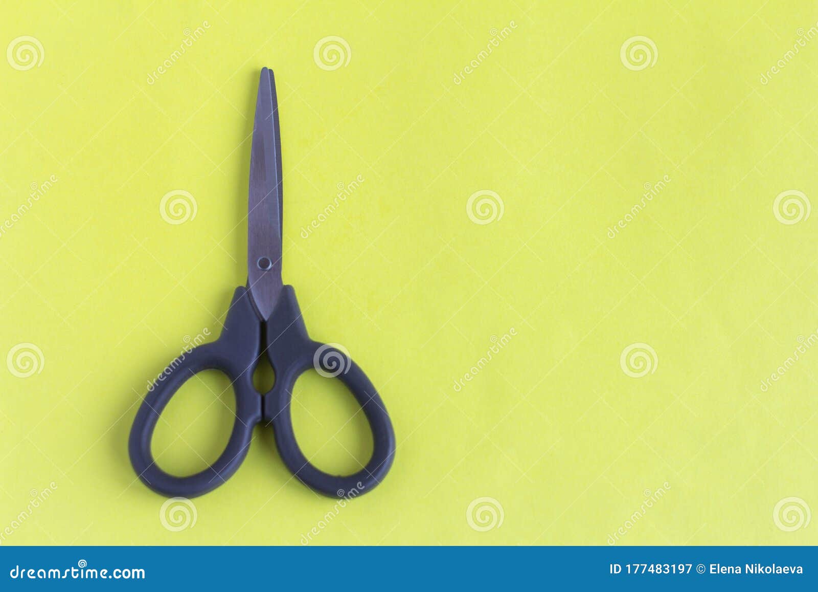 Black Scissors on a Yellow Background.Small Scissors for Cutting Stock ...