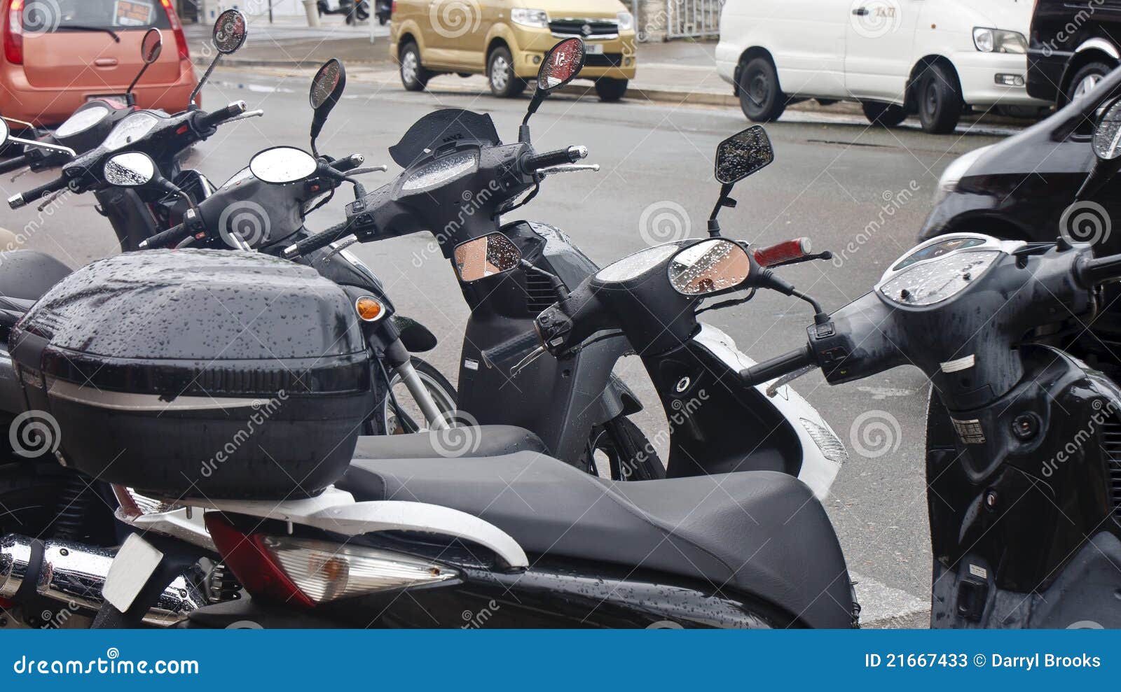 Black Scooters in the Rain stock image. Image of engine - 21667433