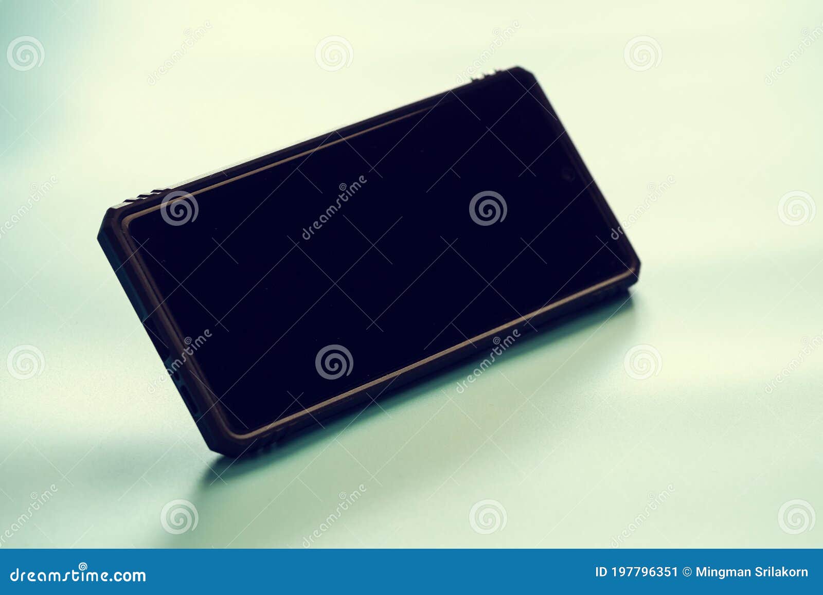 Black Screen Smartphone with the Case and Copy Space on Blue Background ...