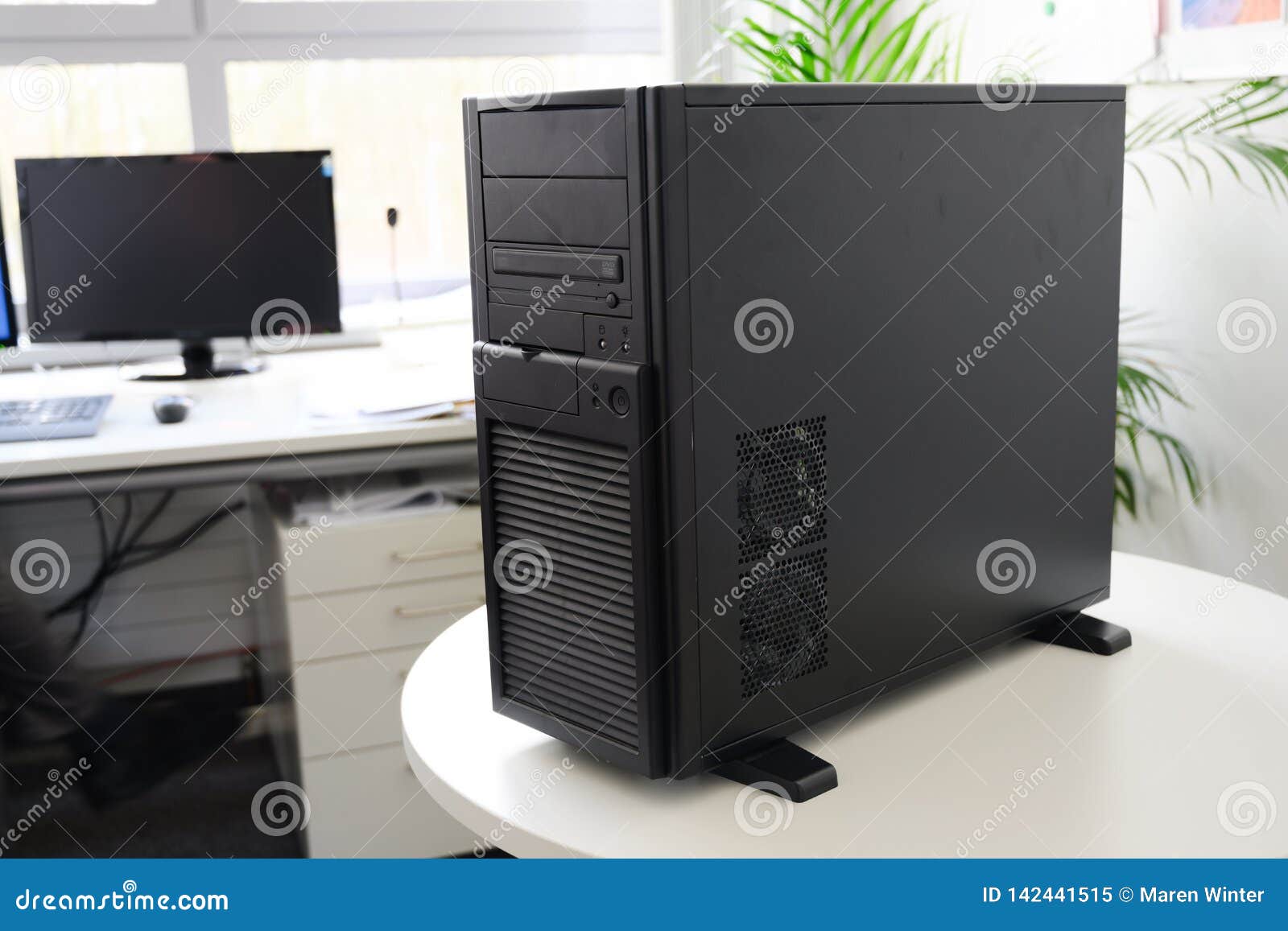 Black Server Computer in a Tower Case on a White Table in the Office ...