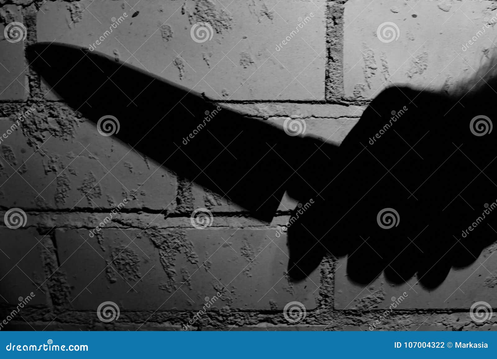 The Black Shadow of the Hand with a Knife Stock Photo - Image of ...