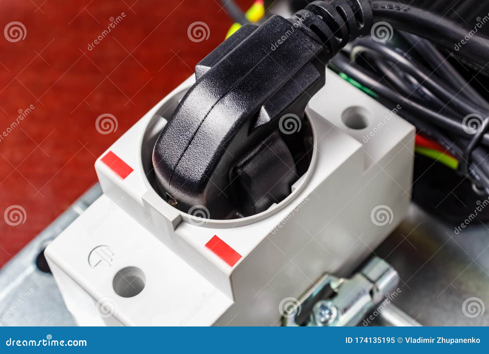 Black and Shiny Power Plug Inserted To the White Electrical Socket on ...