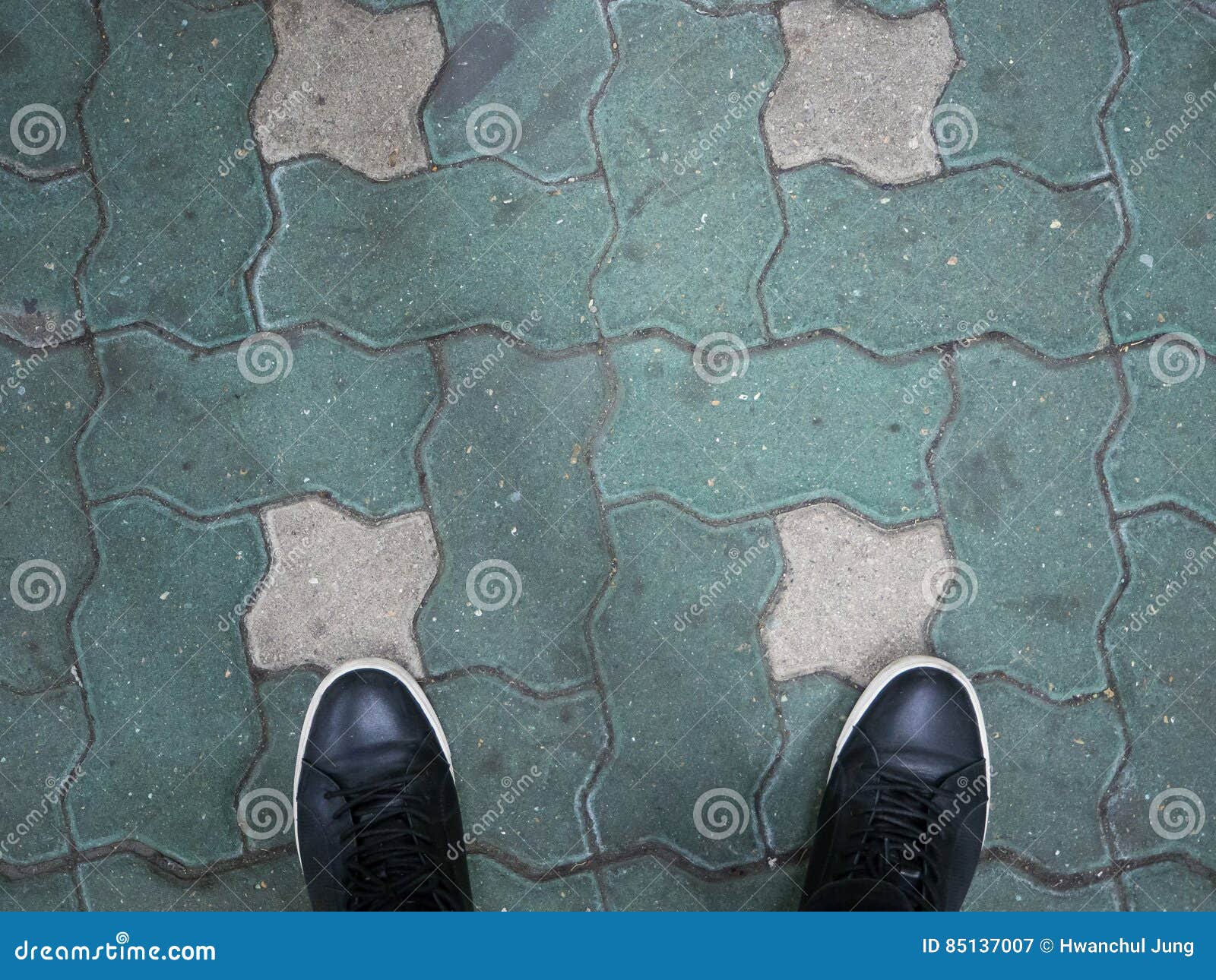 Black Shoes on Concrete Block Background Stock Image - Image of land ...