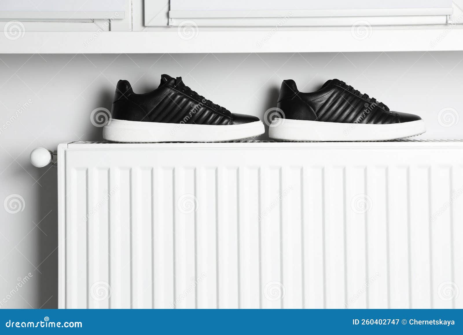 Black Shoes on White Radiator in Room Stock Image - Image of drying ...