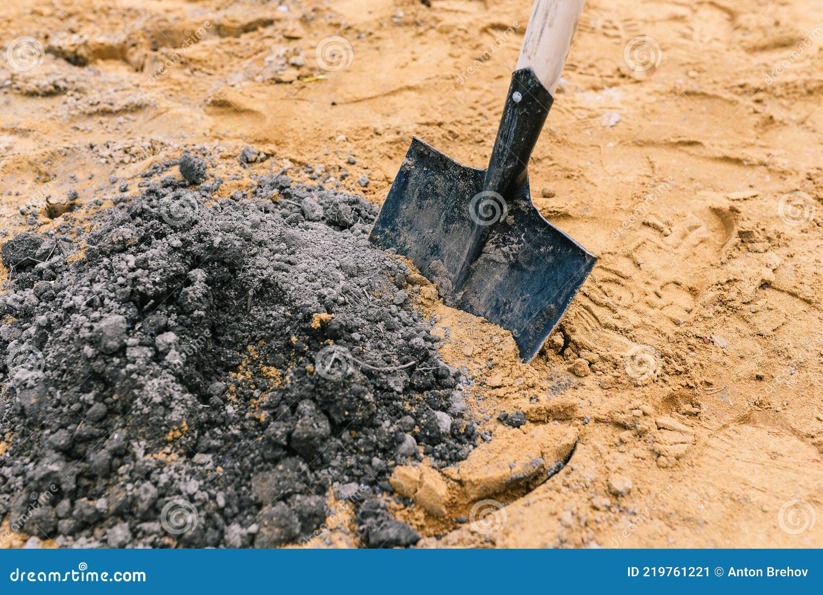 Black Shovel in the Sand. a Tool for Scooping Up Sand in Construction ...