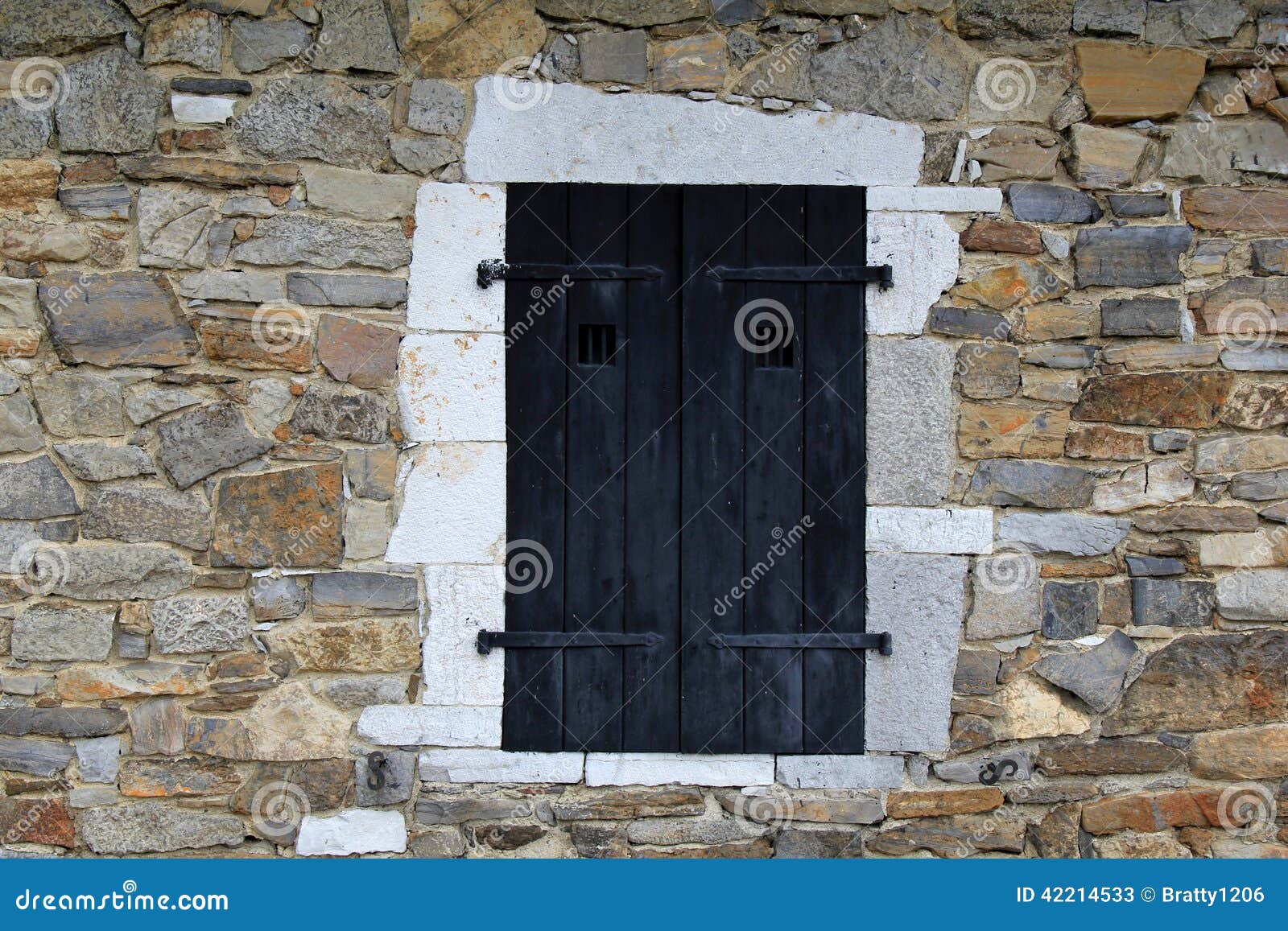 Black Shuttered Window in Stone Wall of Building Stock Image - Image of ...