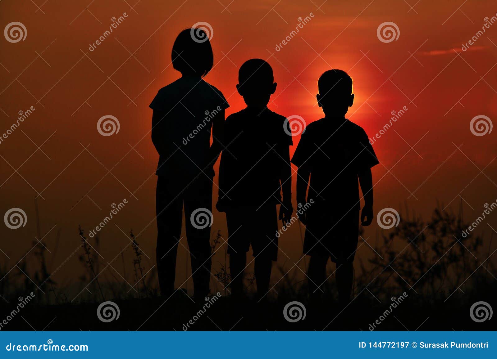 Black Silhouette of Three Children Standing Together. There is a Sky at ...