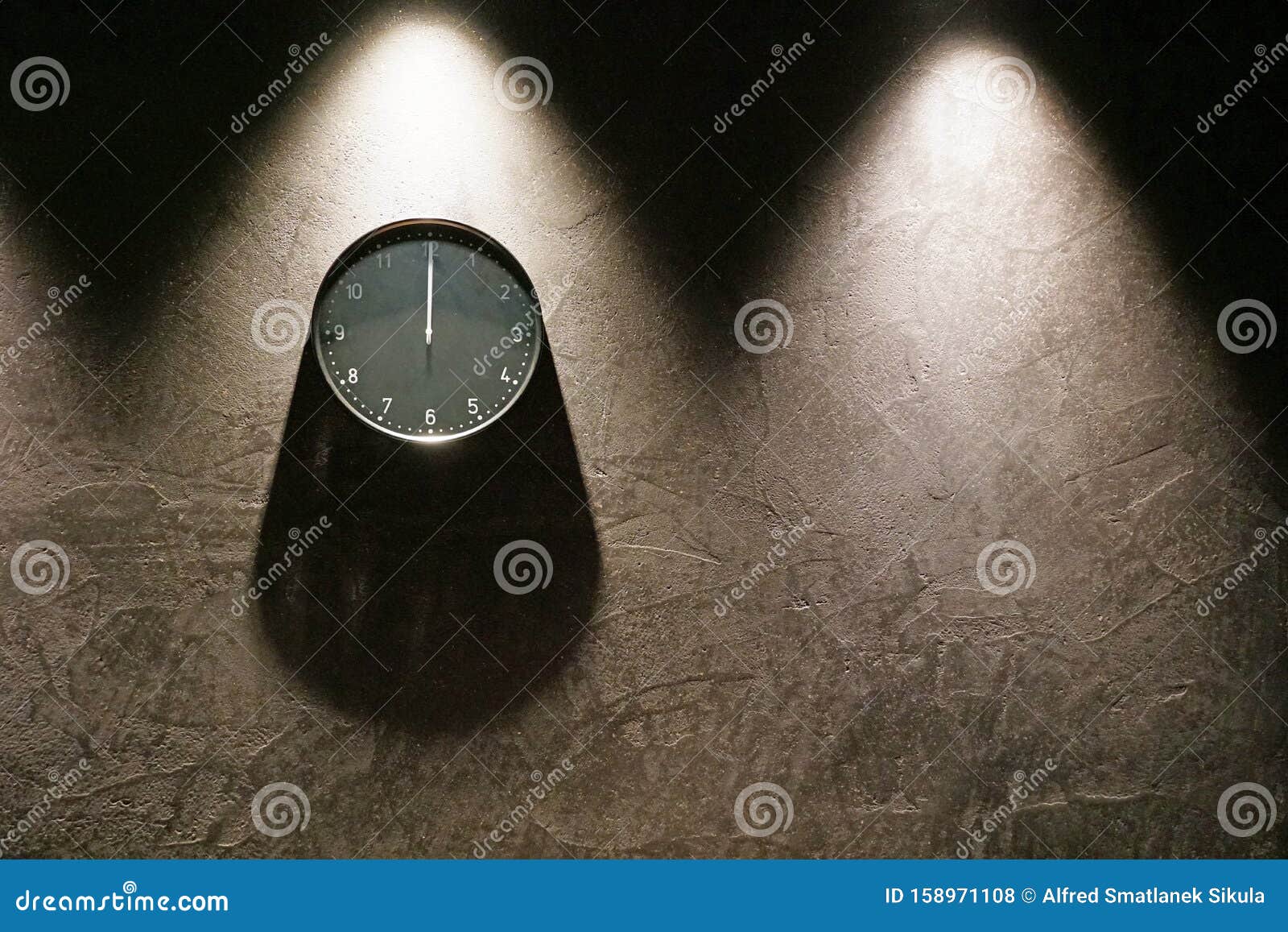 Black Simple Analog Clock Showing Midnight Hanging on the Wall with ...