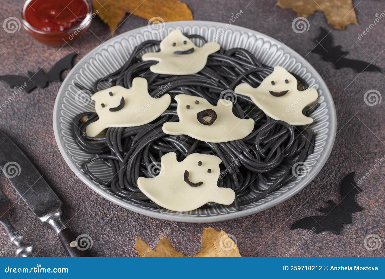 Black Spaghetti and Cheese Ghosts, Edible Halloween Idea Stock Photo ...