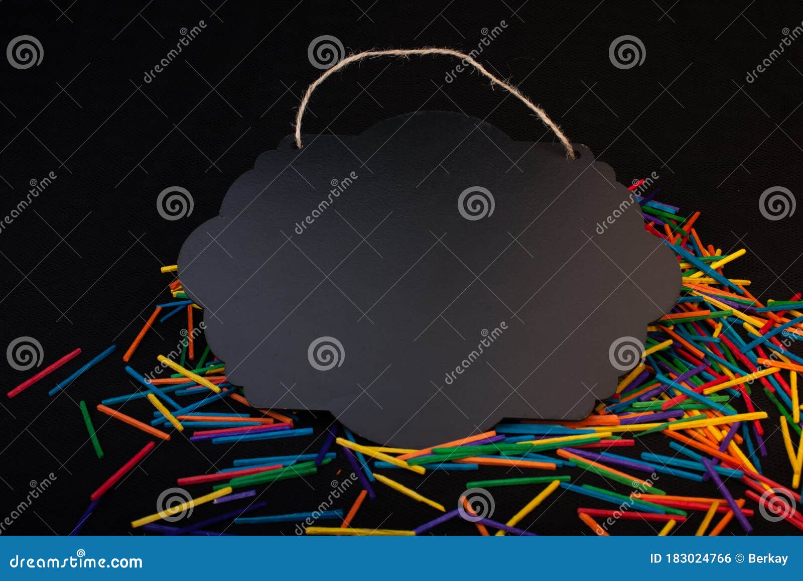 Black Speech Bubble Shaped Notice Board on Colorful Sticks Stock Photo ...