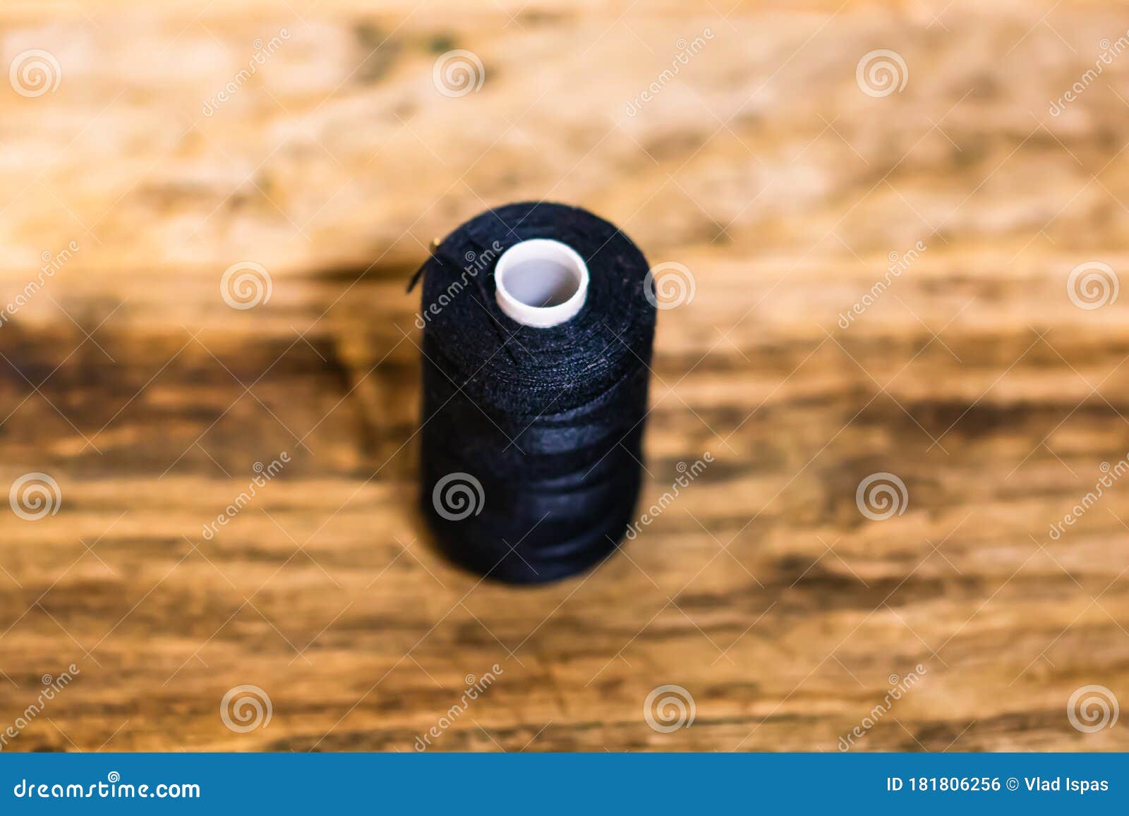 Black Spool of Sewing Threads Isolated on Blurred Background Stock ...