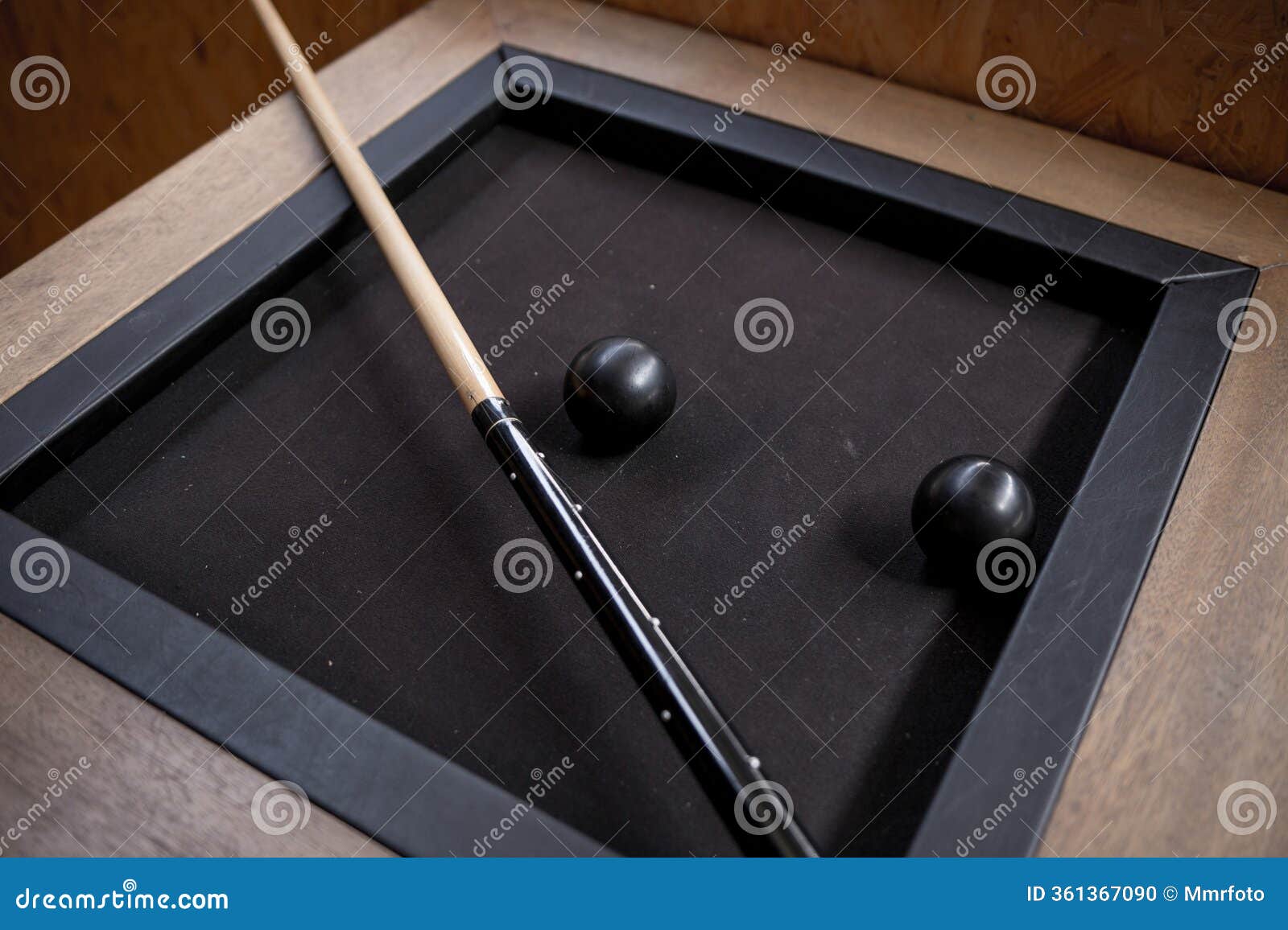 Black Square Pool Table Surface with Two Black Balls and a Cue Stick ...