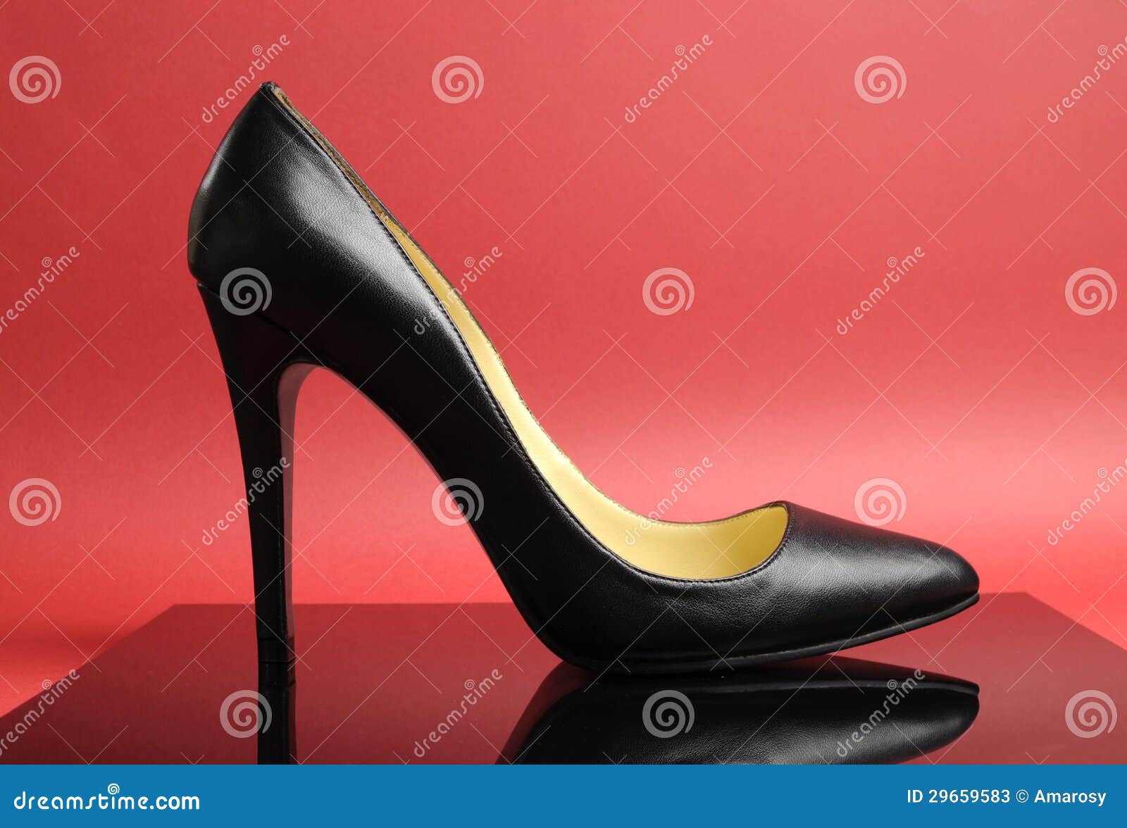 Black Stiletto High Heel Female Shoe on Red Background Stock Image ...