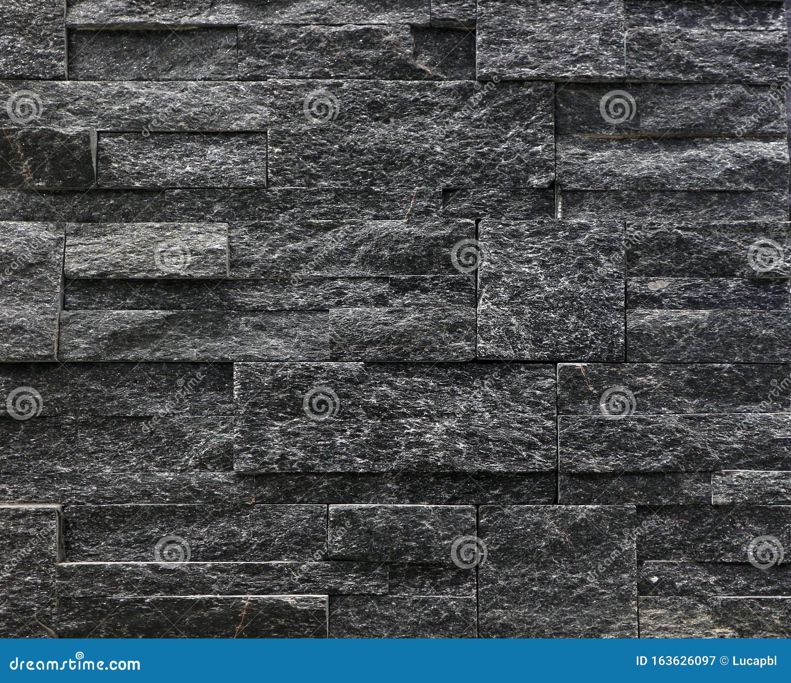 Black Stone Cladding Wall Made with Different Shape Blocks. Background ...