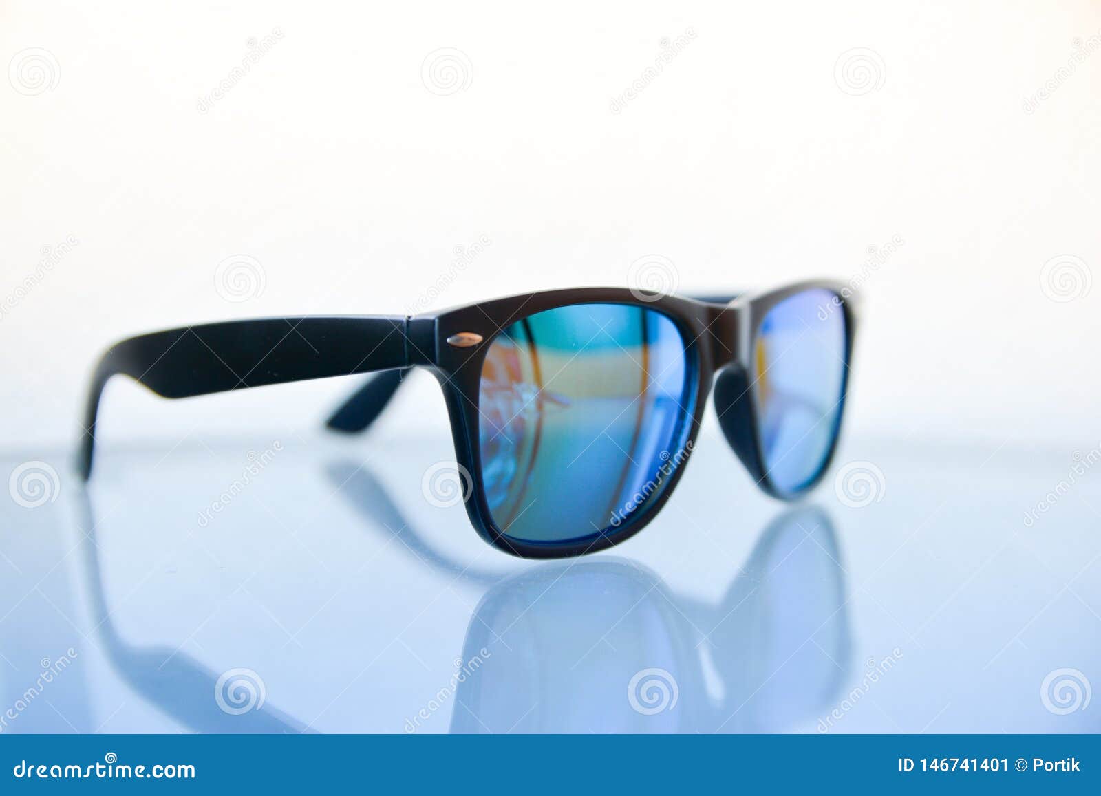 Black Sunglasses With Reflection On White Background Stock Image