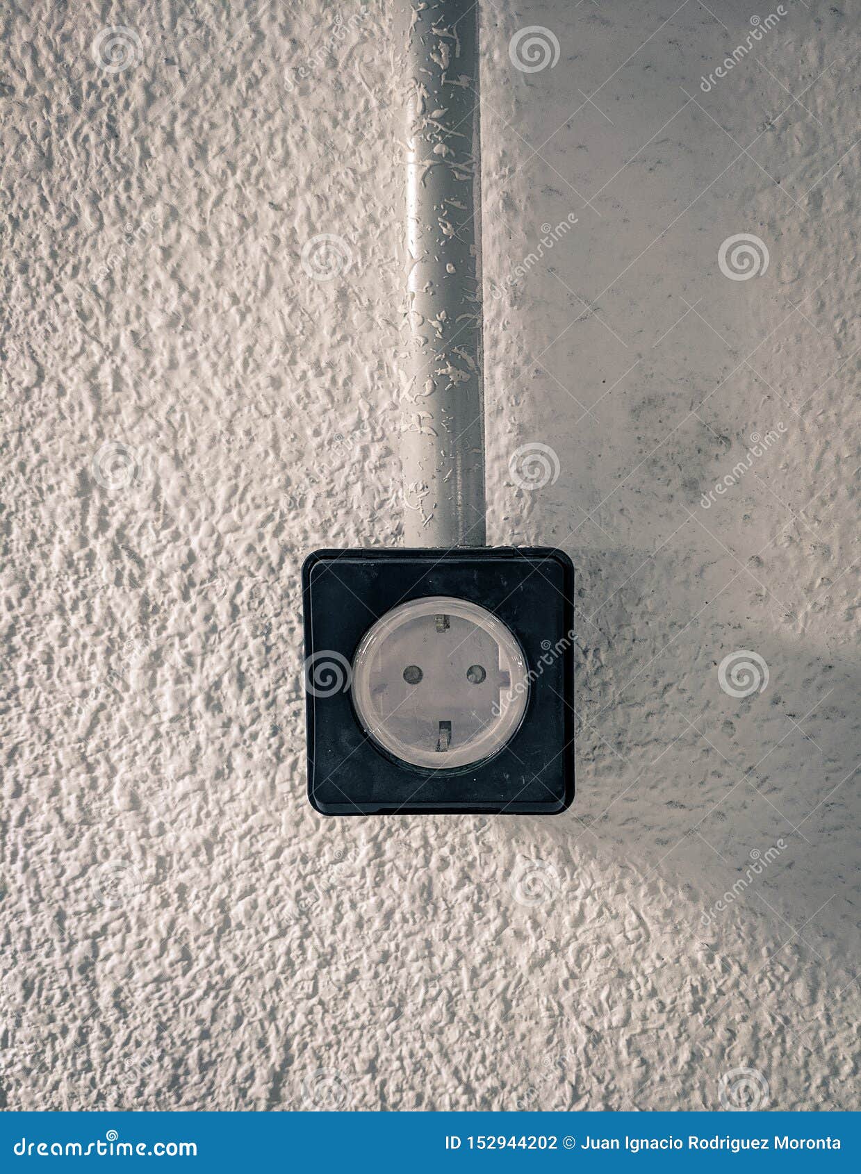 Black Surface Plug on Wall in Garage Stock Photo - Image of ground ...