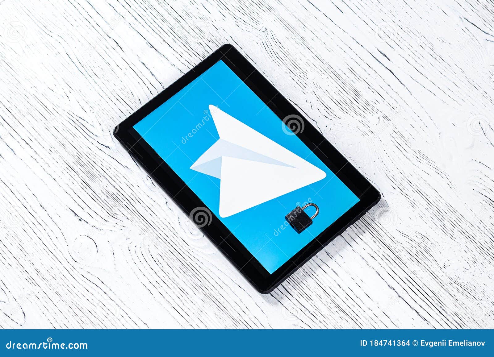 Black Tablet Computer on a White Wooden Table with a Messenger Telegram ...