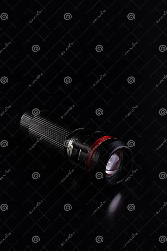 Black Tactical Flashlight on a Black Background Stock Photo - Image of ...