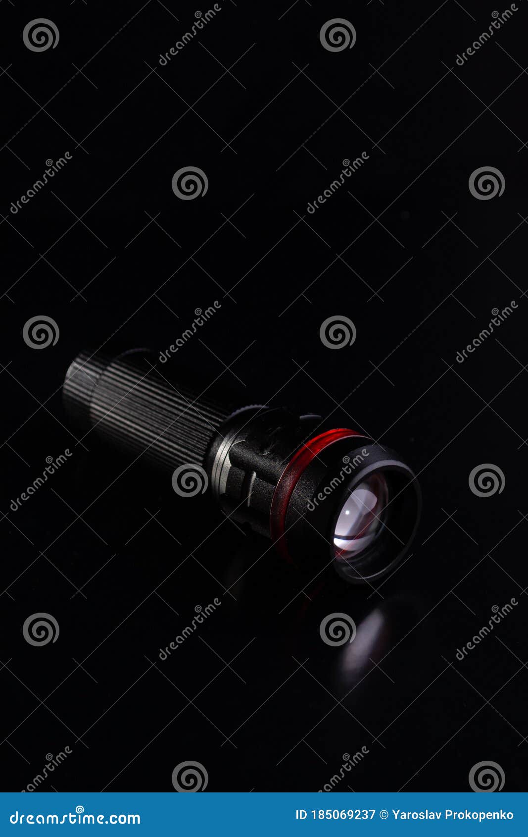 Black Tactical Flashlight on a Black Background Stock Image - Image of ...