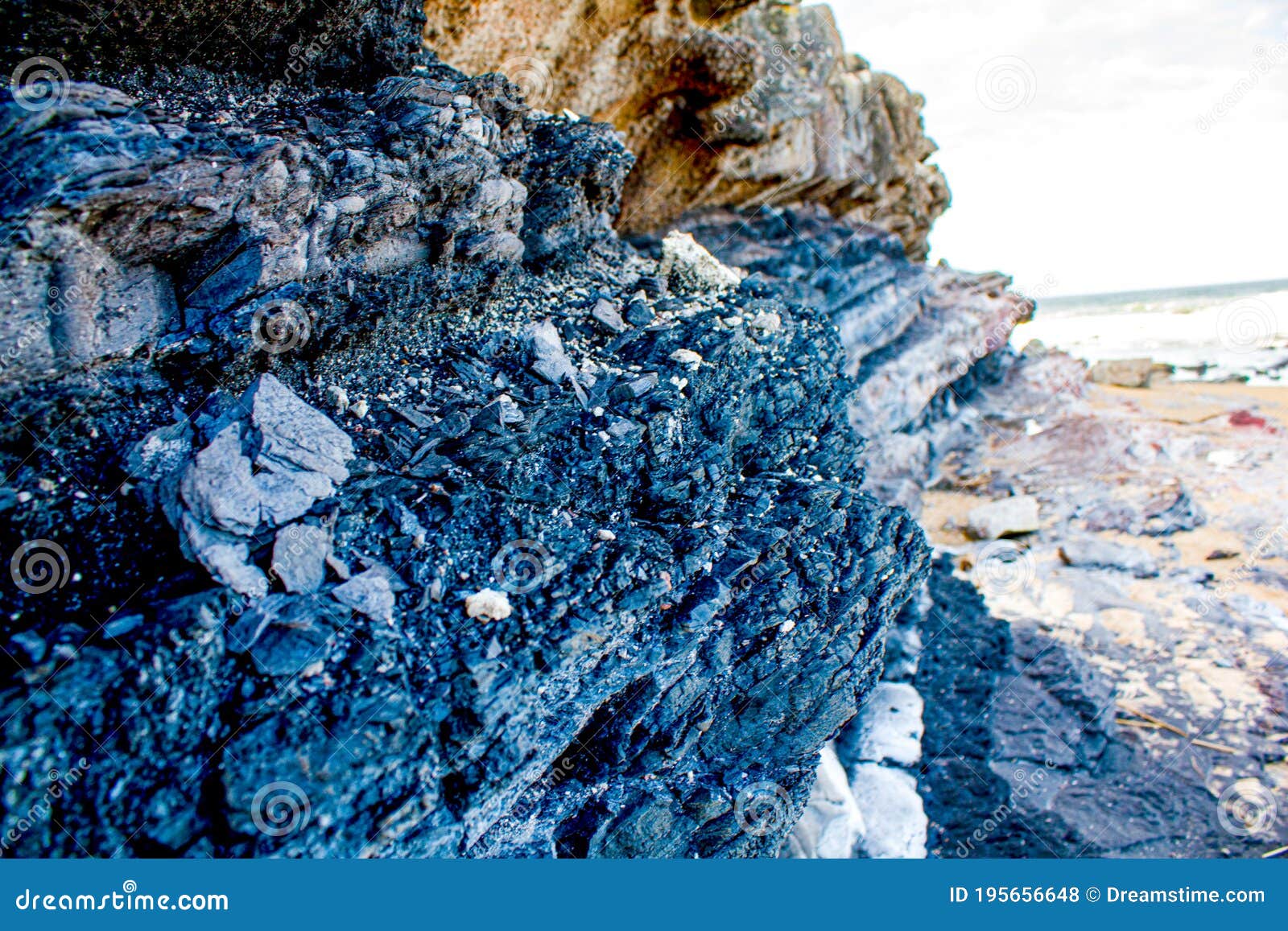 Black Tar Seem Cliff Face stock photo. Image of face - 195656648