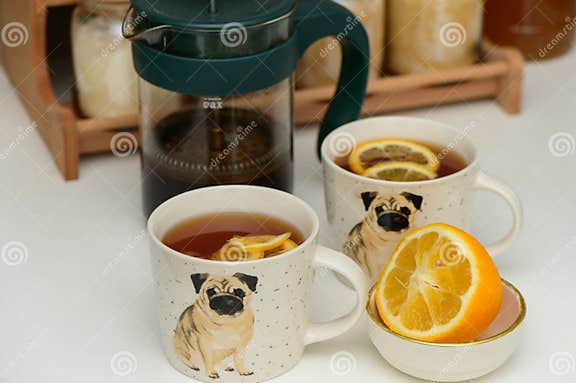 Black Tea with Lemon in Cups with a Drawn Pug 3 Stock Photo - Image of ...