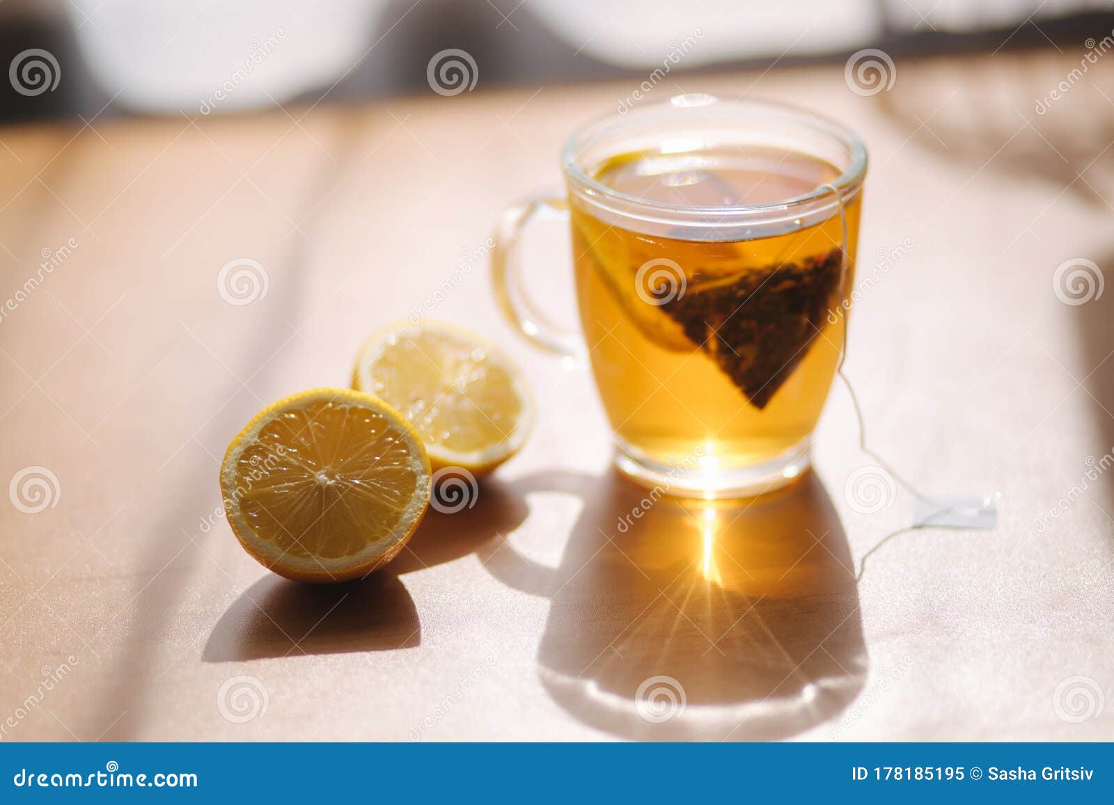 Black Tea with Lemon on Wooden Table. Tea Bag with Lemon Slice in Cup ...