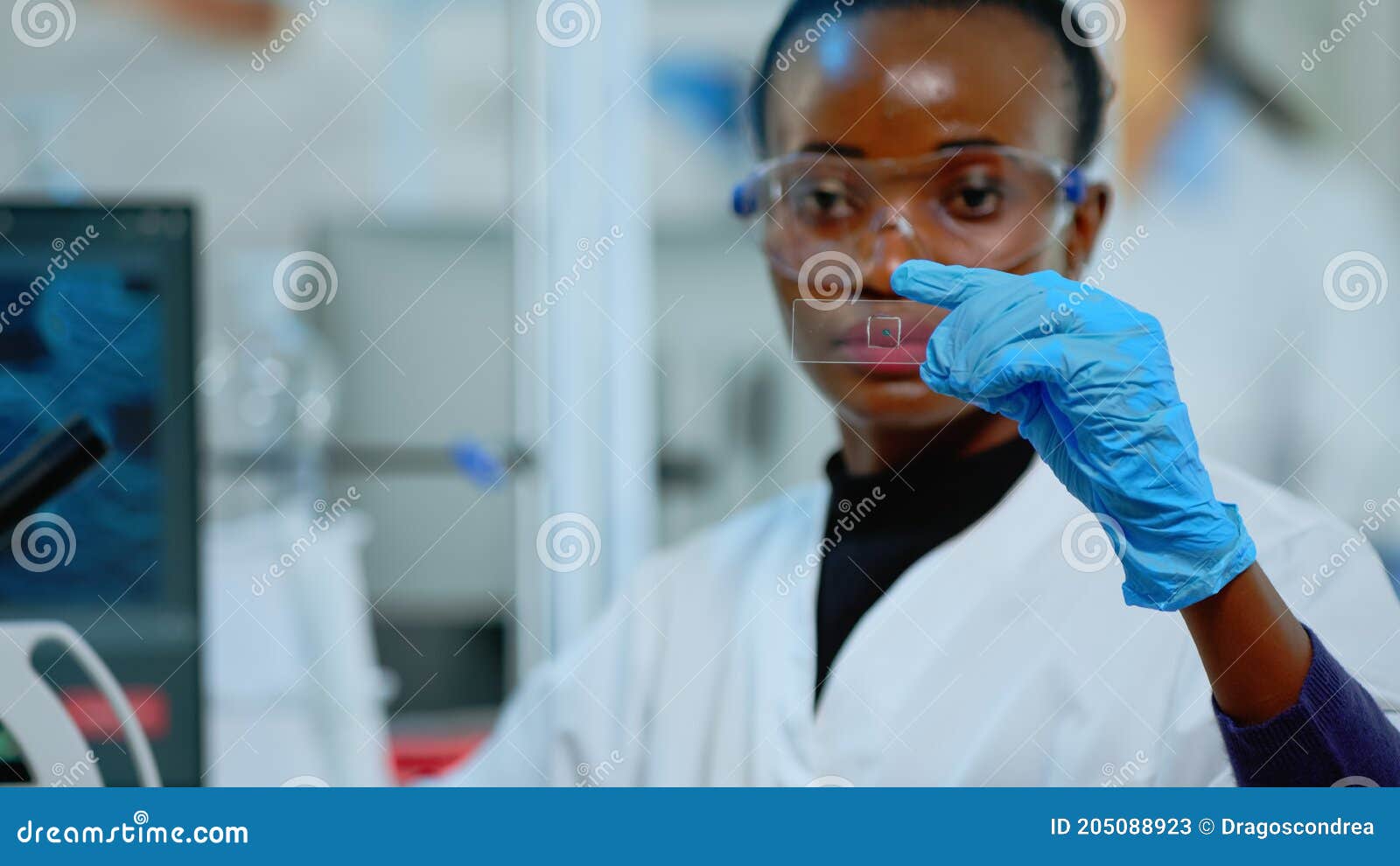 Black Lab Technician Doing Experiment in Lab Looking at Result Stock ...