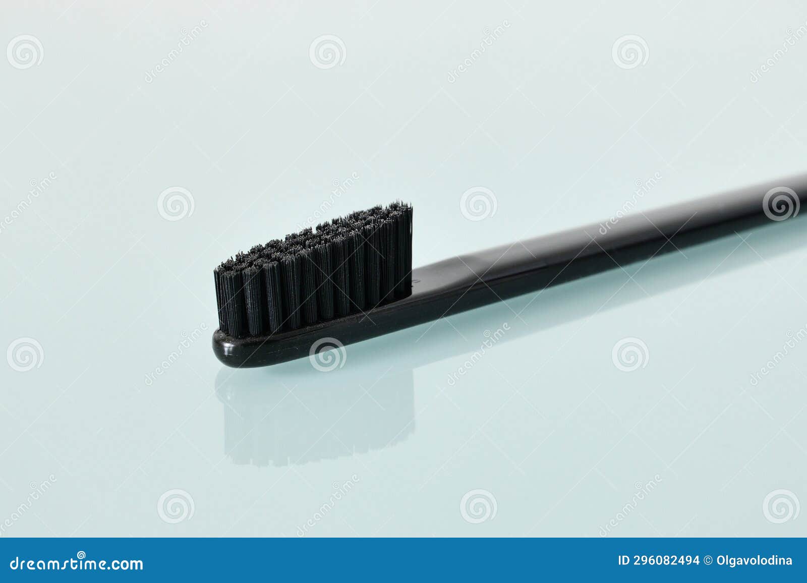 Black Toothbrush on a Light Blue Background Stock Photo - Image of ...