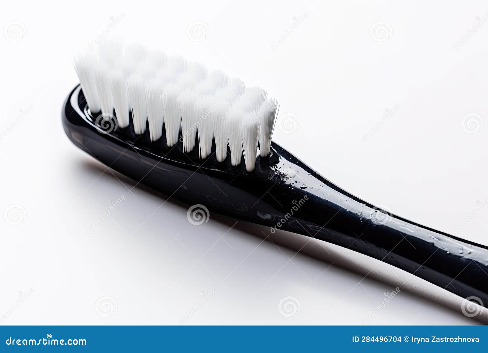 Black Toothbrush with White Bristles on a White Background Stock ...