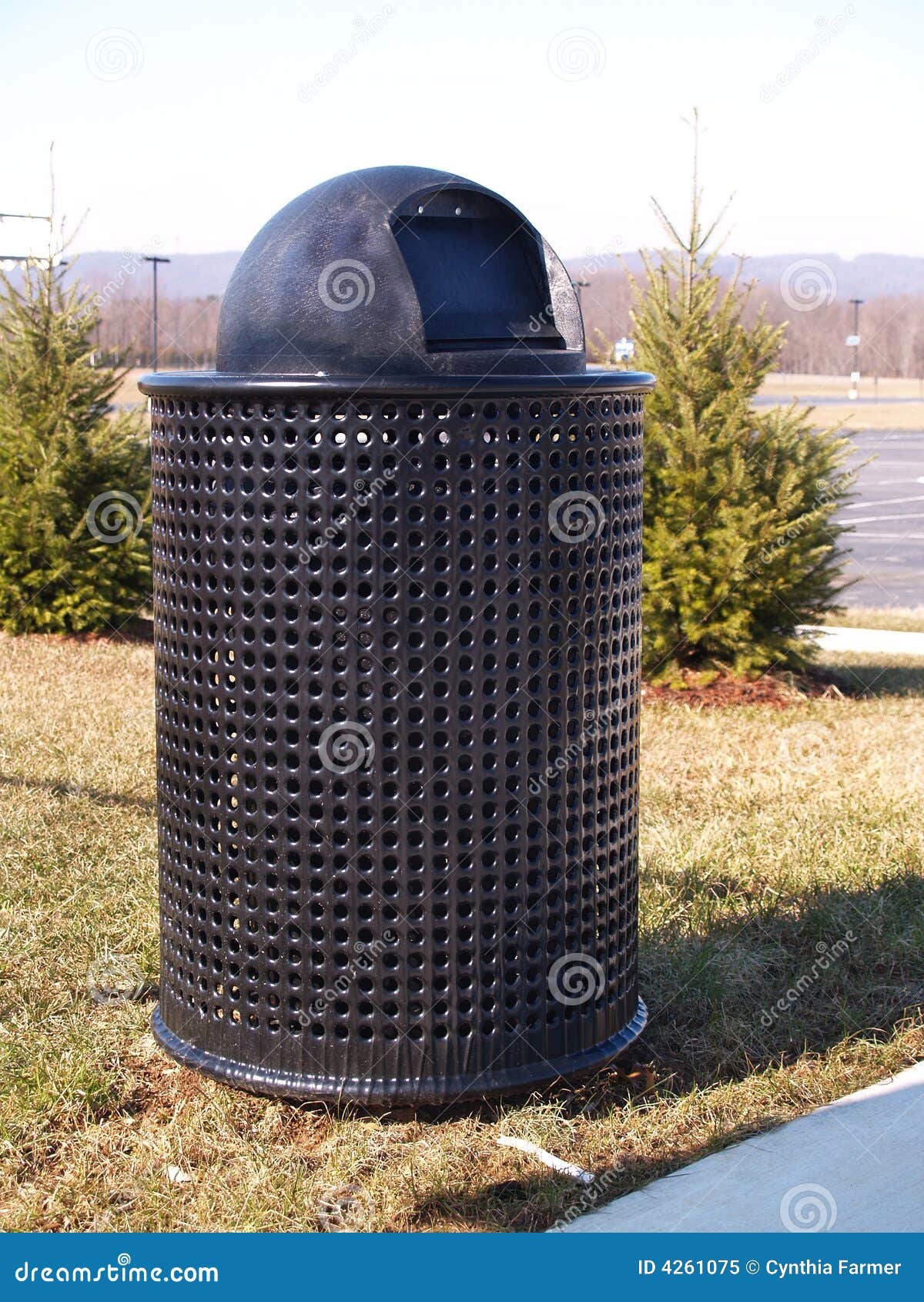 Black trash can by trees stock image. Image of dispose - 4261075