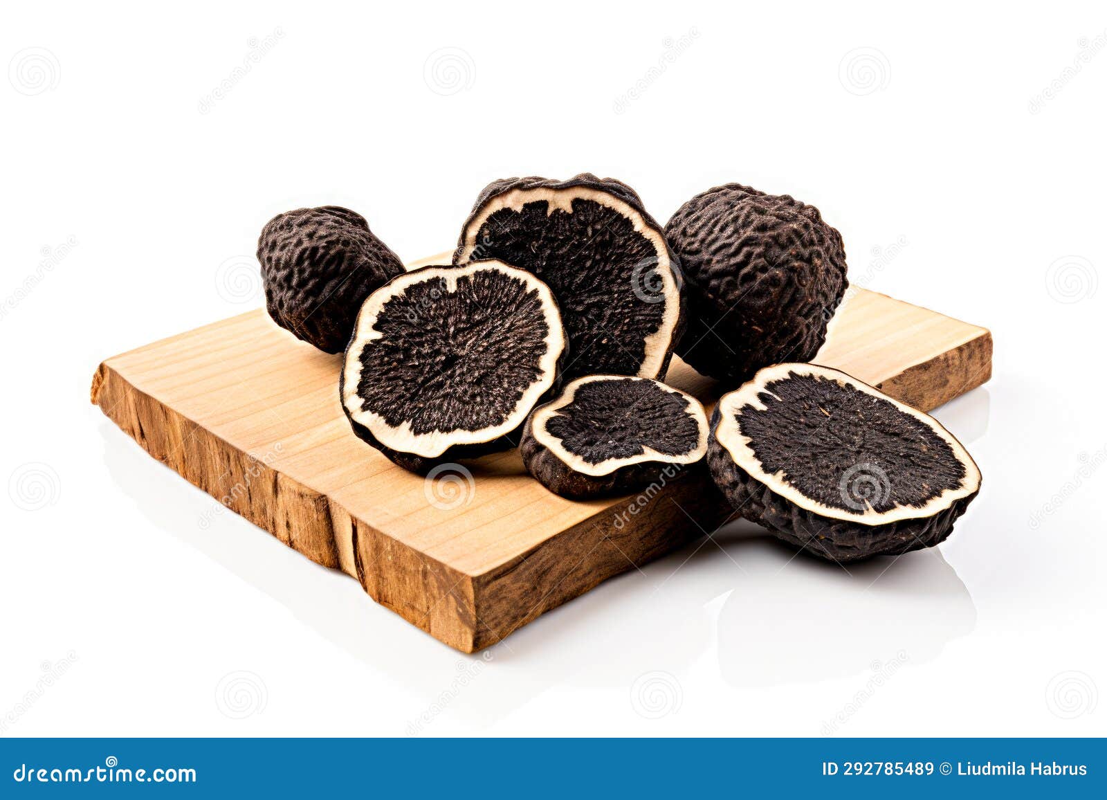 Black Truffles on a Cutting Board Isolated on White Background. Stock ...