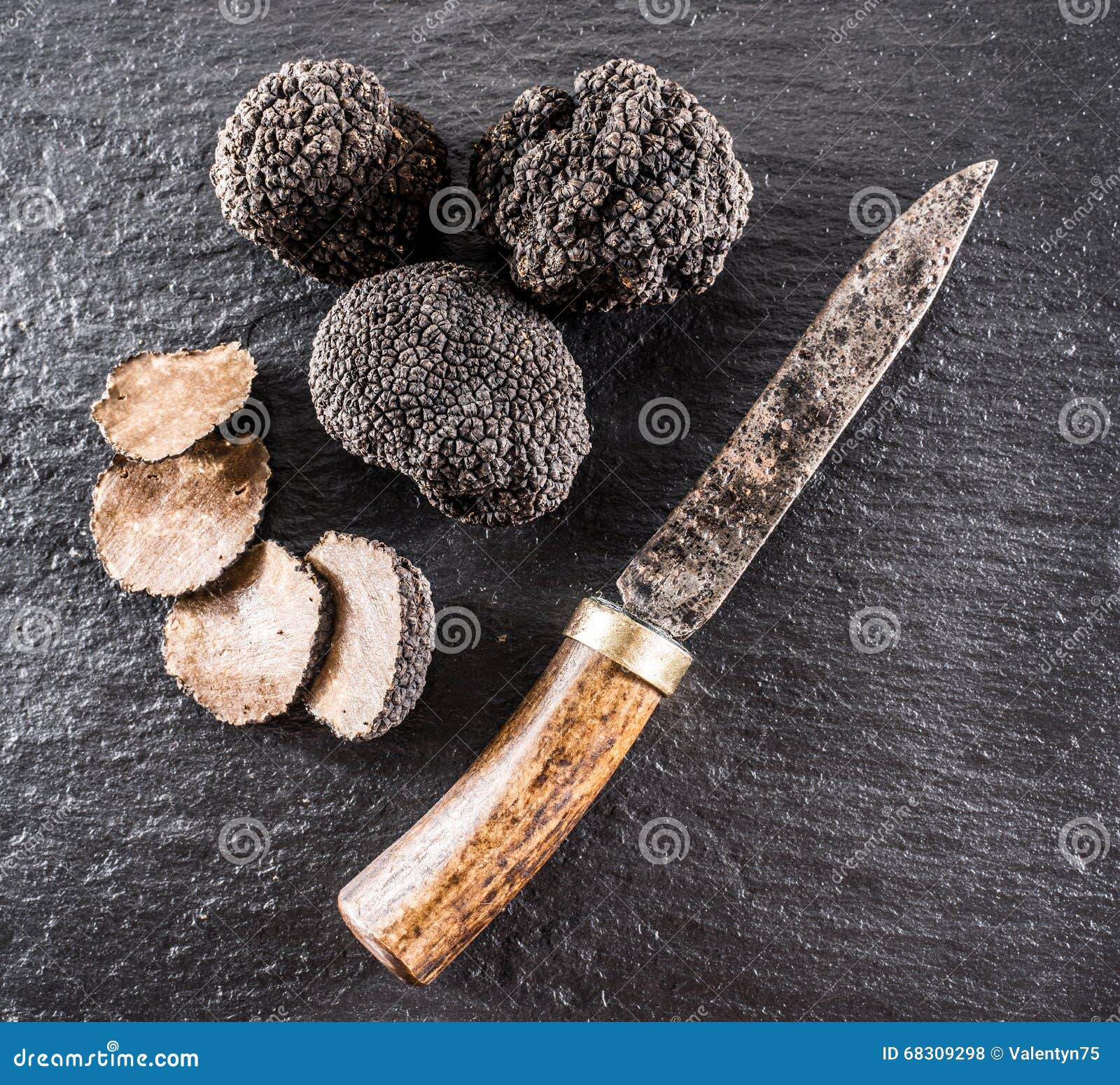 Black Truffles and Truffle Slices on a Graphite Board. Stock Photo ...