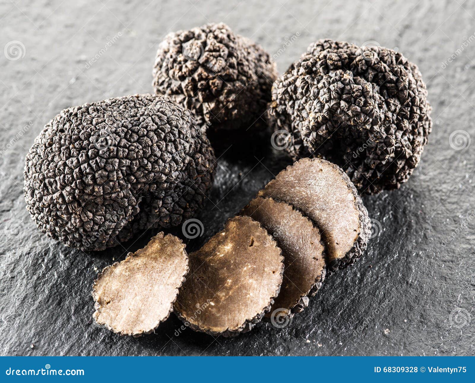 Black Truffles and Truffle Slices on a Graphite Board. Stock Photo ...