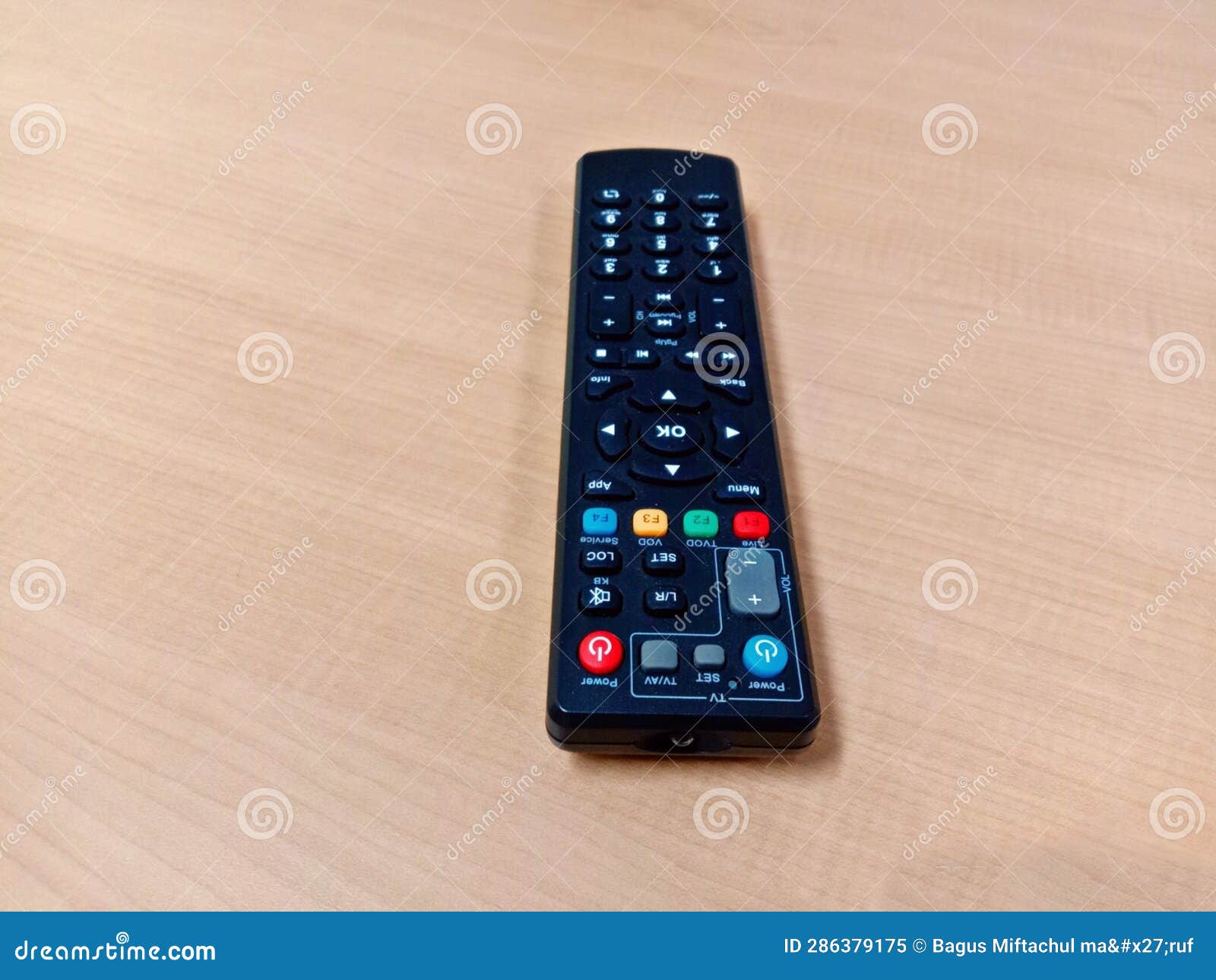 A Black TV Remote on a Brown Table Stock Image - Image of popcorn ...