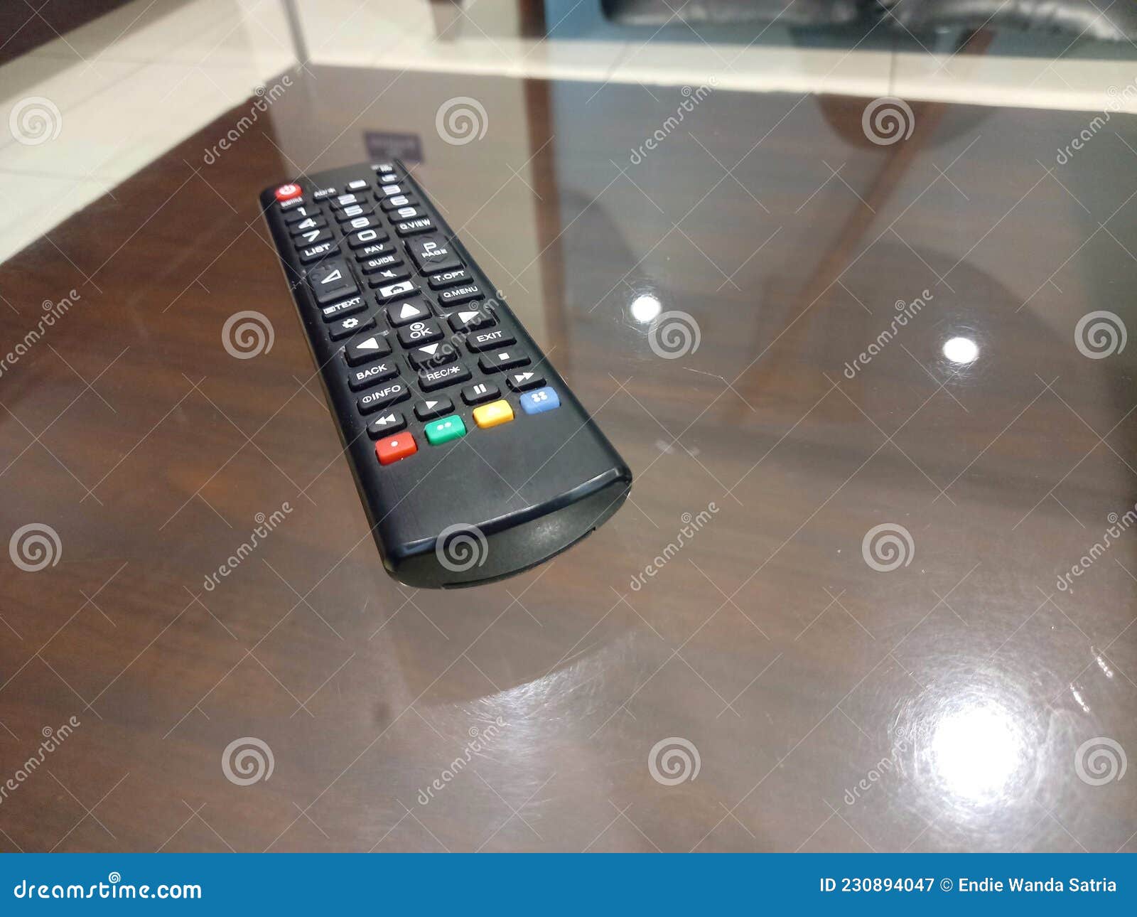 Black Tv Remote on the Table Stock Image - Image of woodtable, blue ...