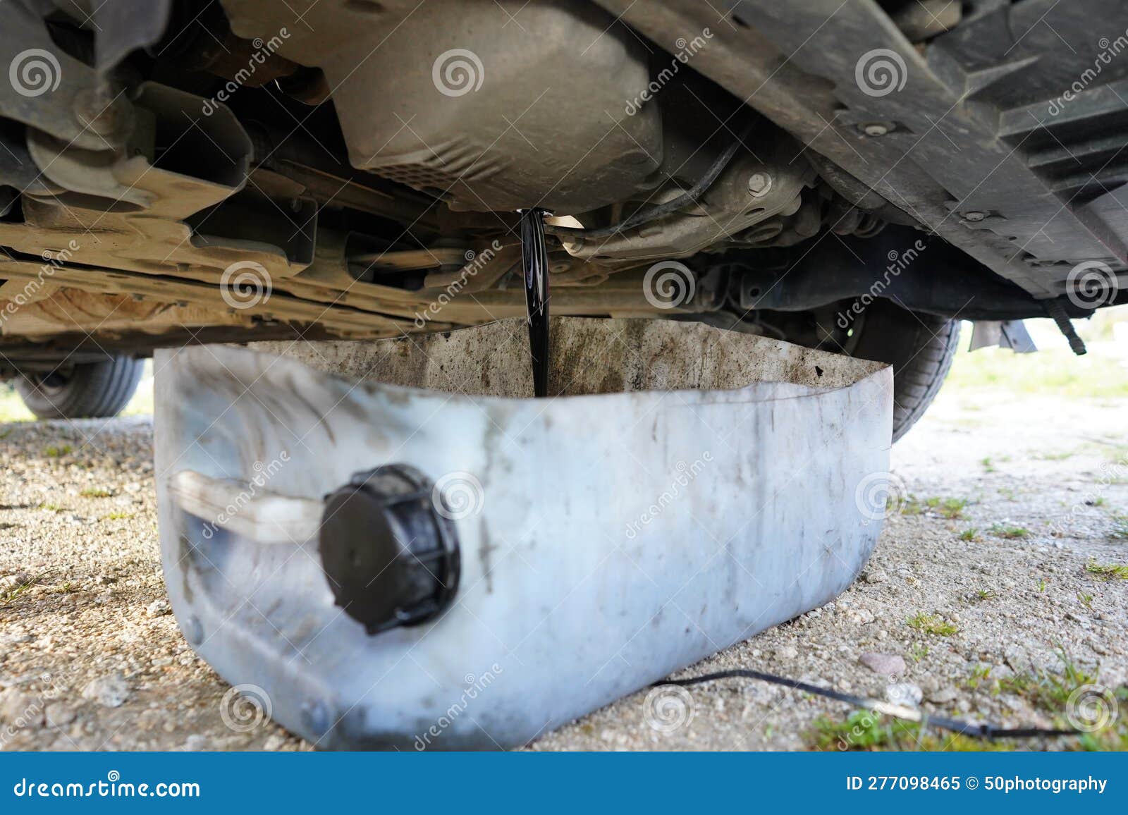 Used Drained Motor Oil In A Black Tray And Used Oil Filter. DIY Change ...