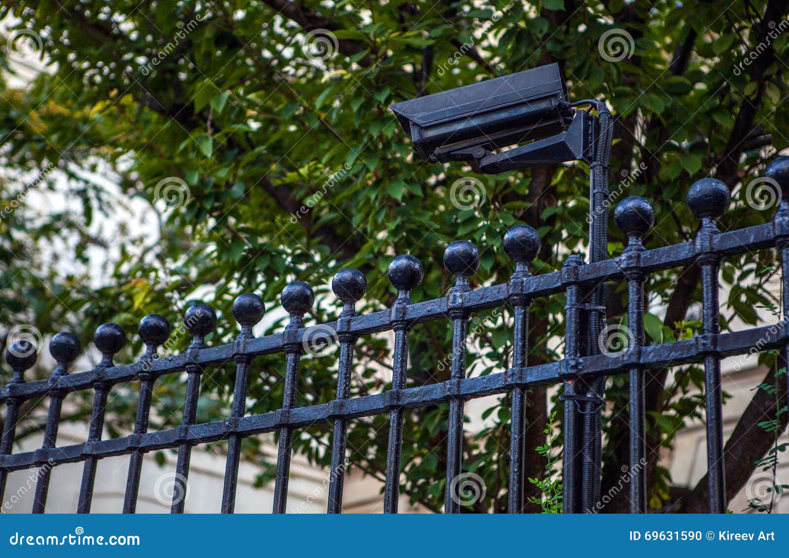 Black Video Camera Security System on the Metal Fence Stock Photo ...
