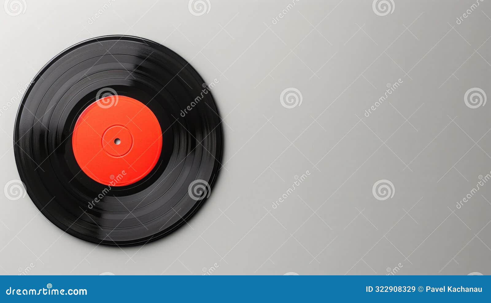 A Black Vinyl Record with a Red Label Sits on a White Surface Stock ...