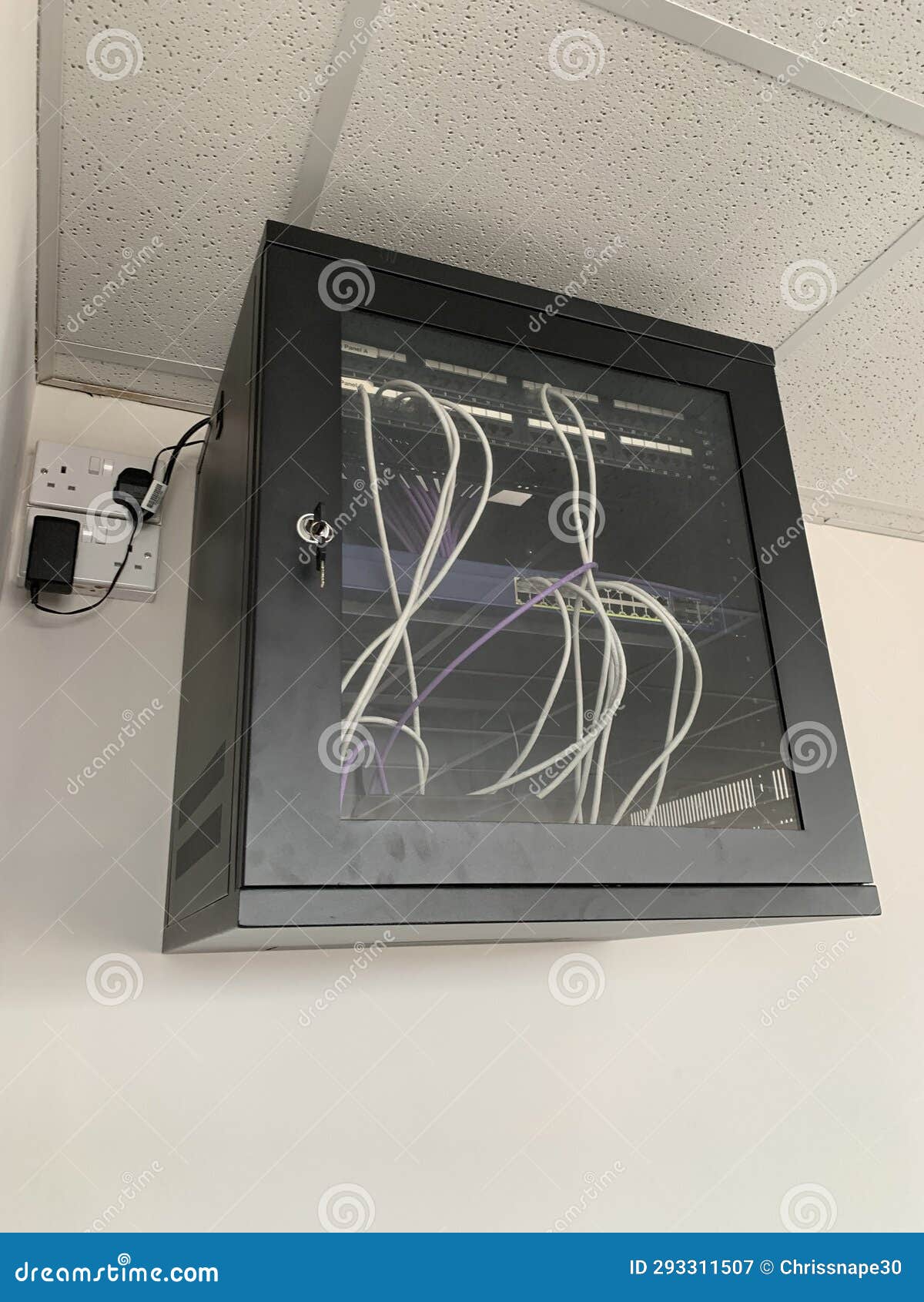 Black Wall Mounted it Cabinet with a Network Switch and Patch Panel ...
