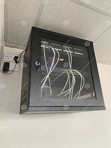Black Wall Mounted it Cabinet with a Network Switch and Patch Panel ...