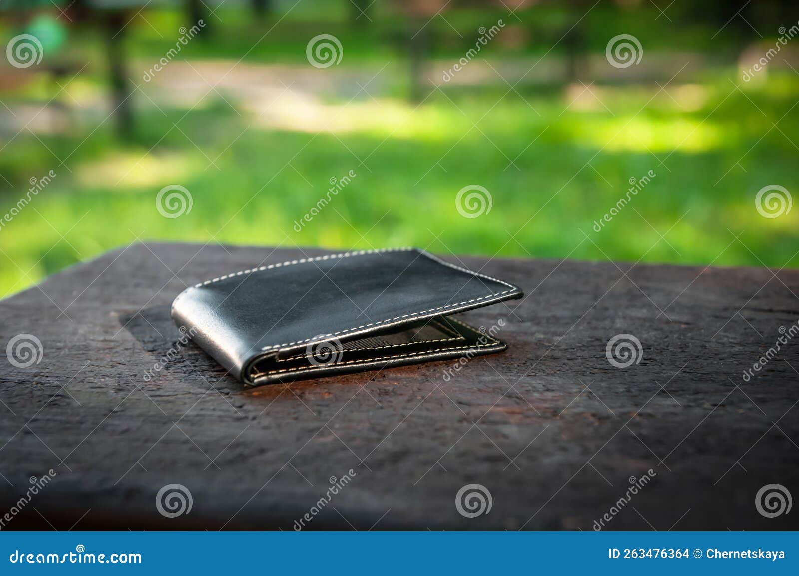 Black Wallet on Bench Outdoors. Lost and Found Stock Photo - Image of ...