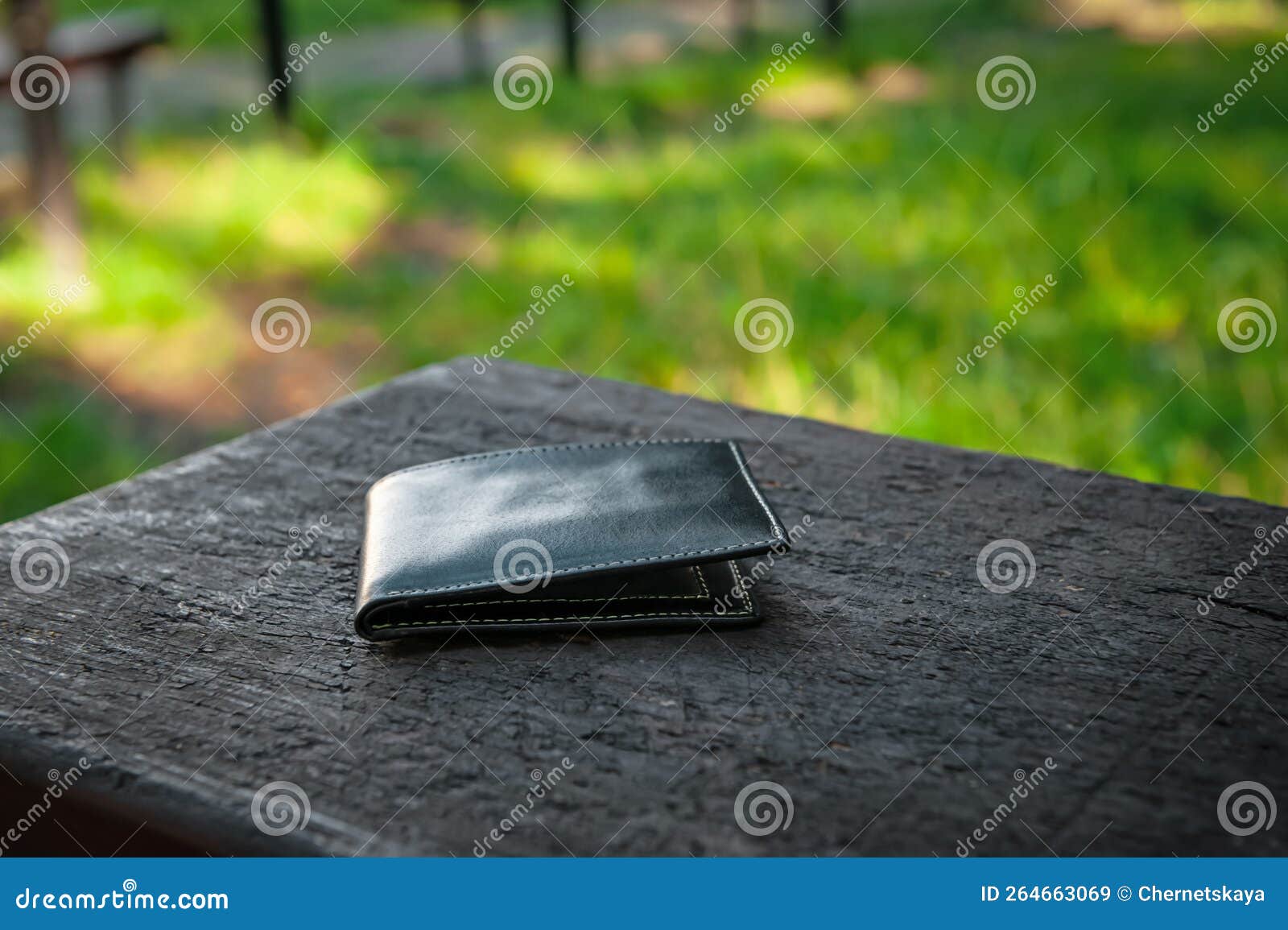 Black Wallet on Bench Outdoors. Lost and Found Stock Image - Image of ...