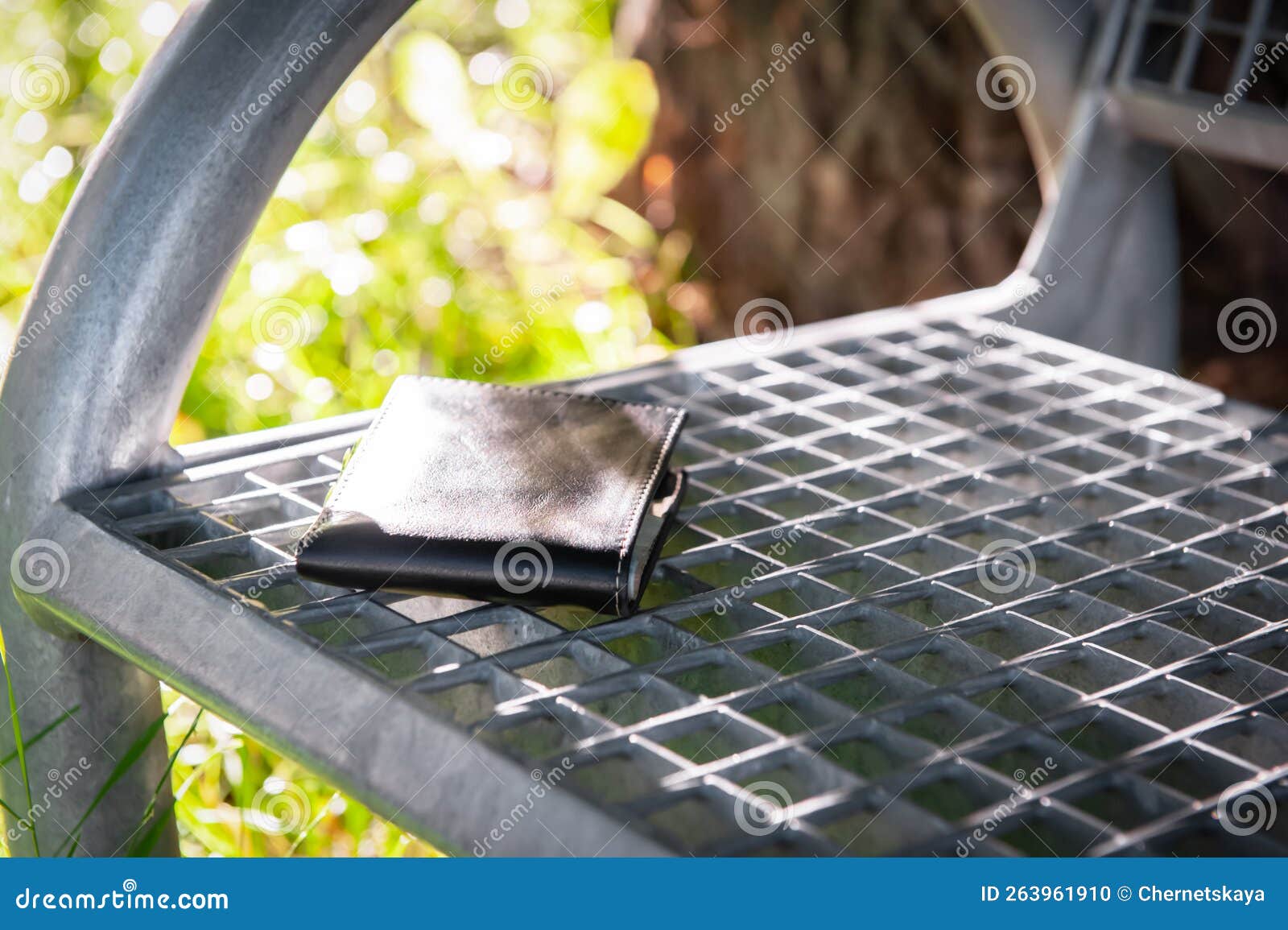 Black Wallet on Metal Bench Outdoors. Lost and Found Stock Photo ...